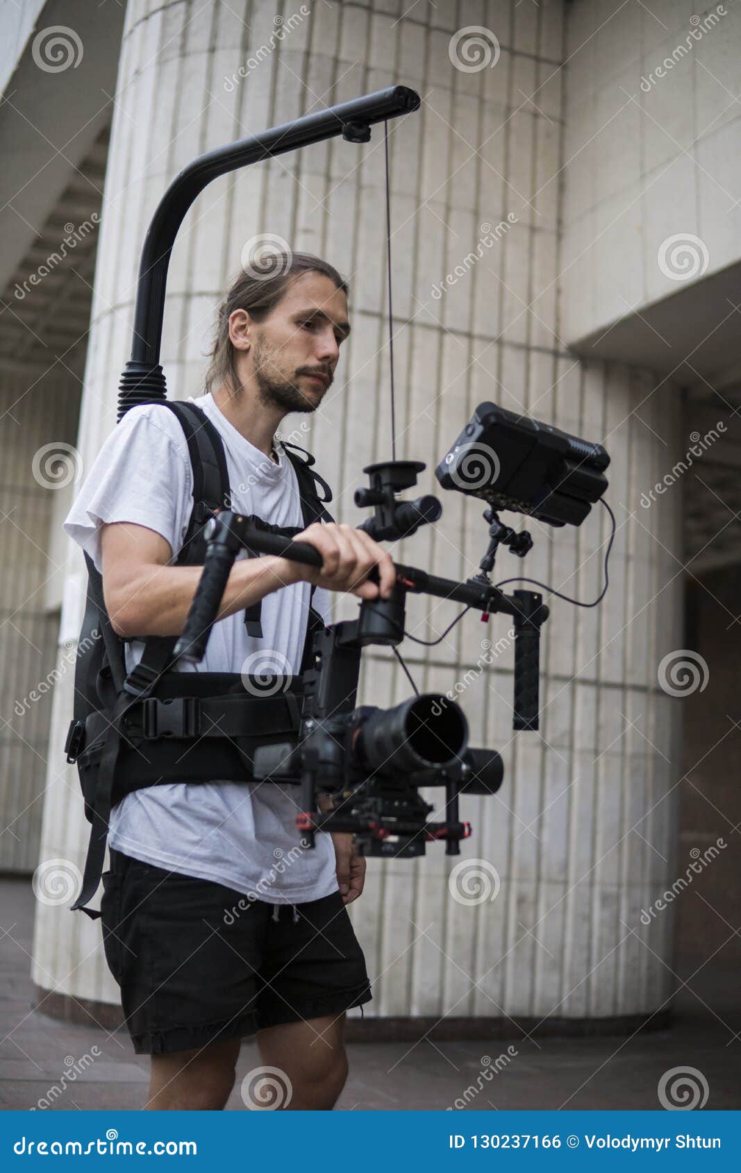 Professional Videographer Holding Camera on 3-axis Gimbal Which Mounted ...