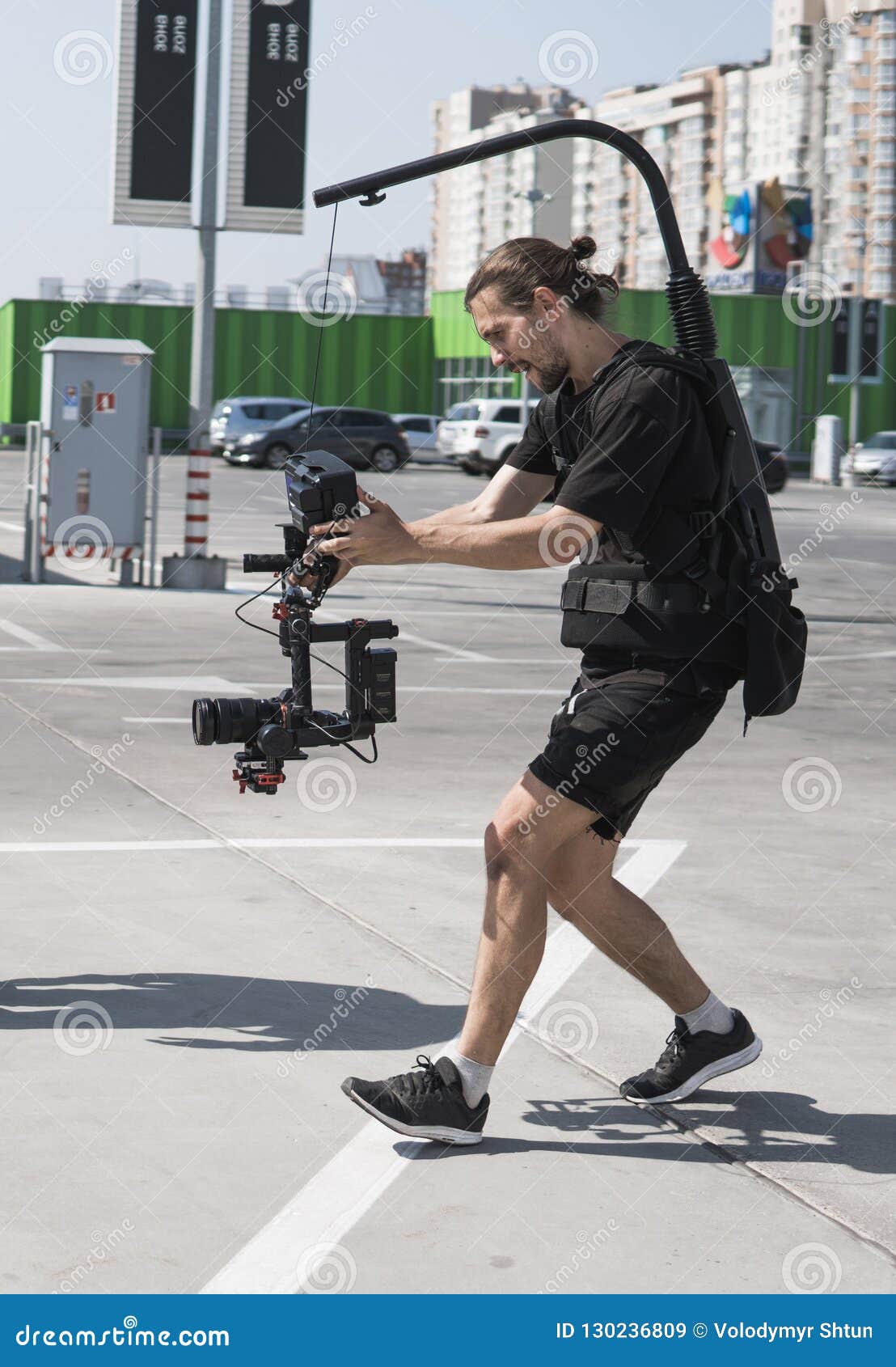 Professional Videographer Holding Camera on 3-axis Gimbal Which Mounted ...