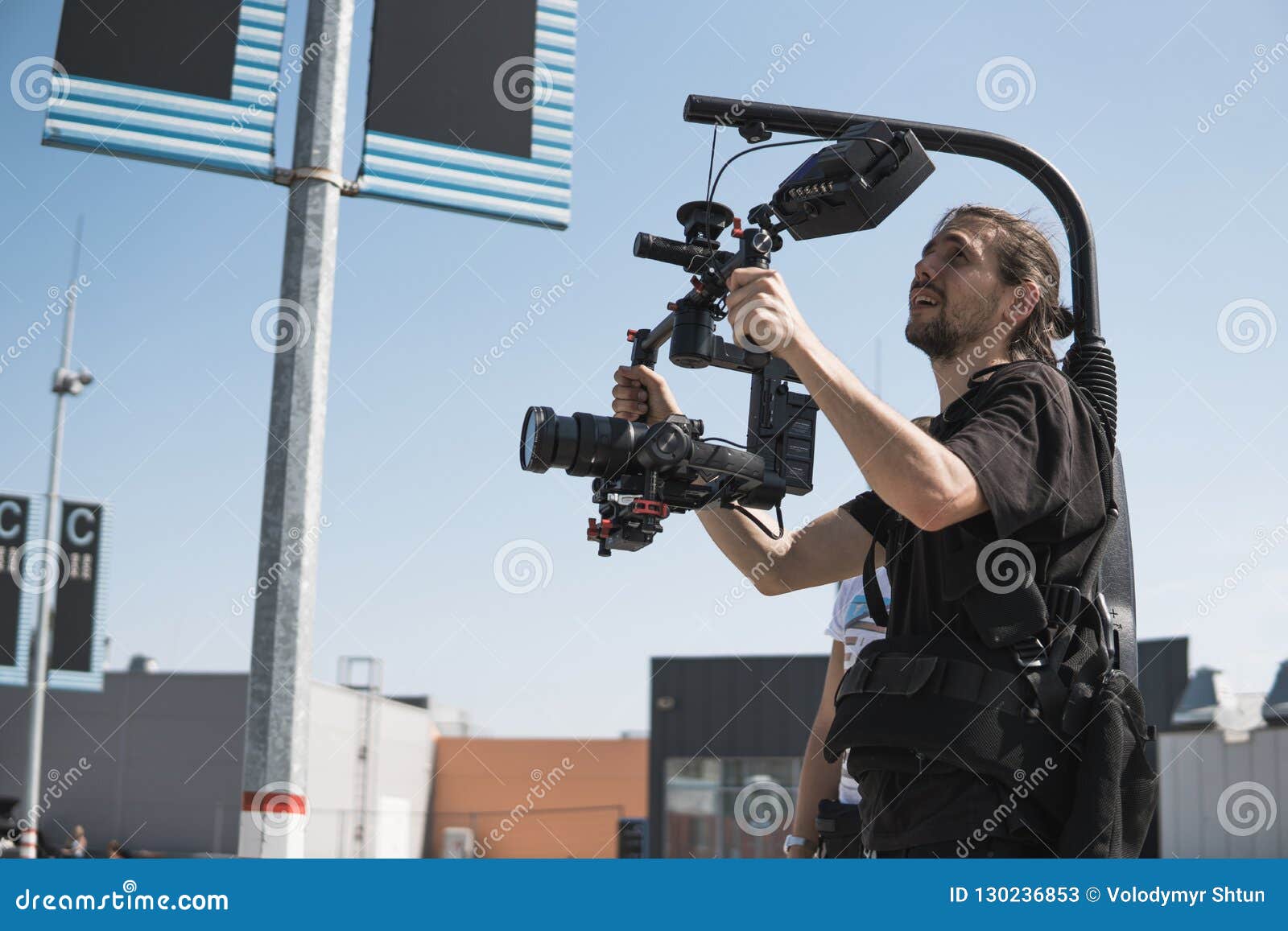Professional Videographer Holding Camera on 3-axis Gimbal Which Mounted ...