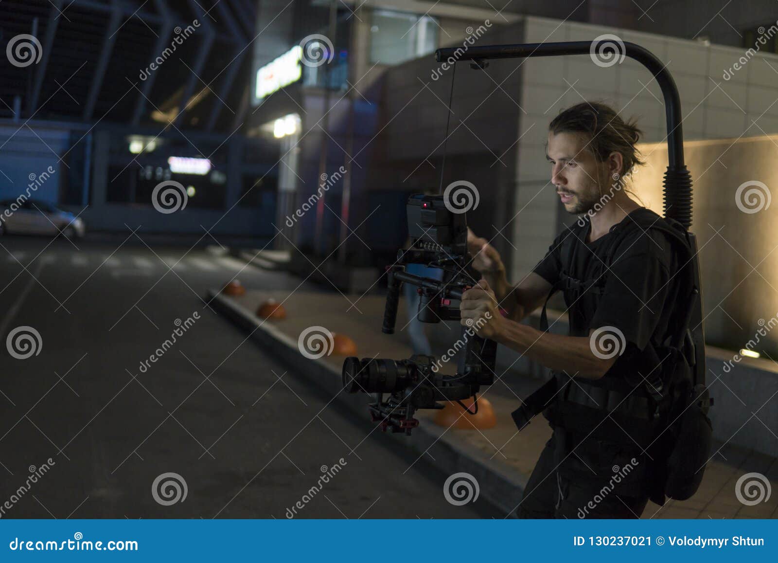 Professional Videographer Holding Camera on 3-axis Gimbal Which Mounted ...