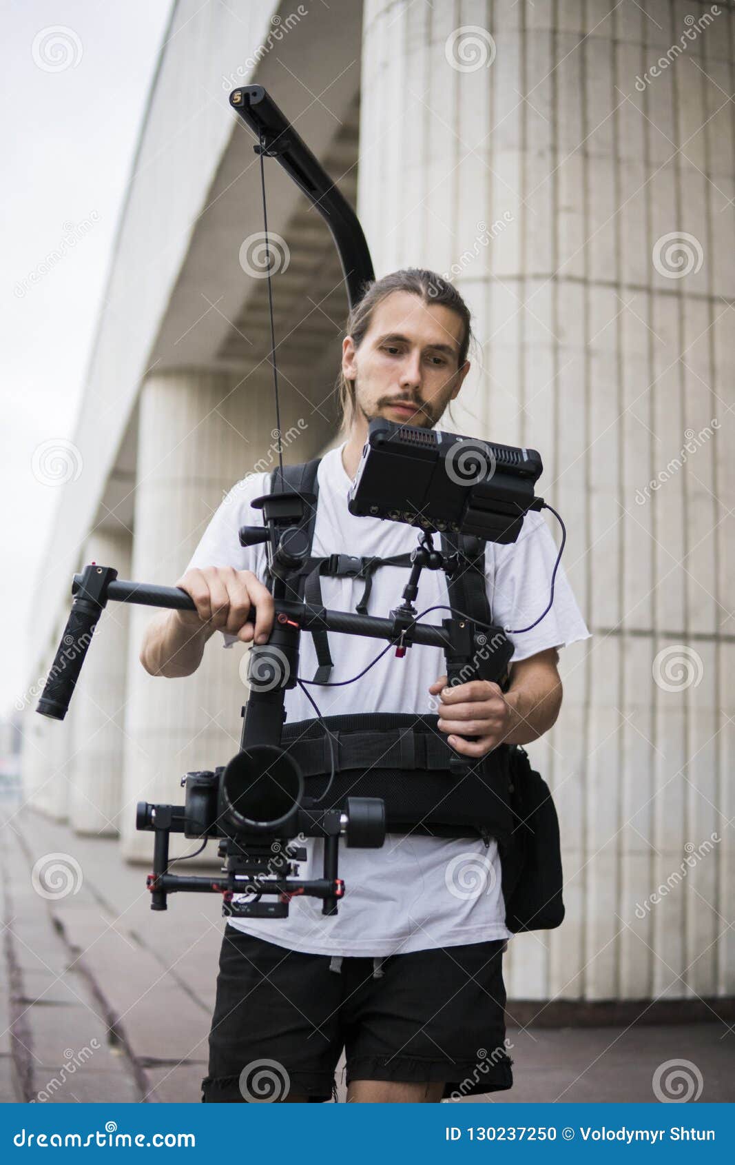 Professional Videographer Holding Camera on 3-axis Gimbal Which Mounted ...