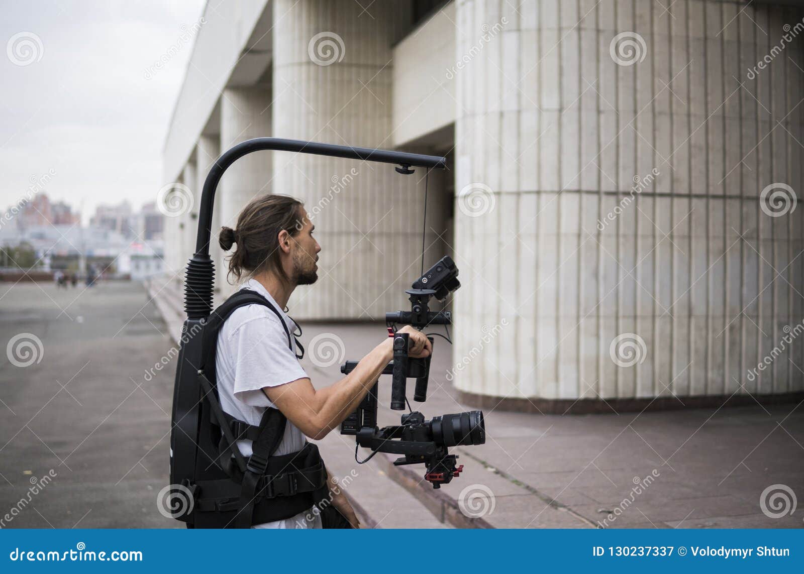 Professional Videographer Holding Camera on 3-axis Gimbal Which Mounted ...