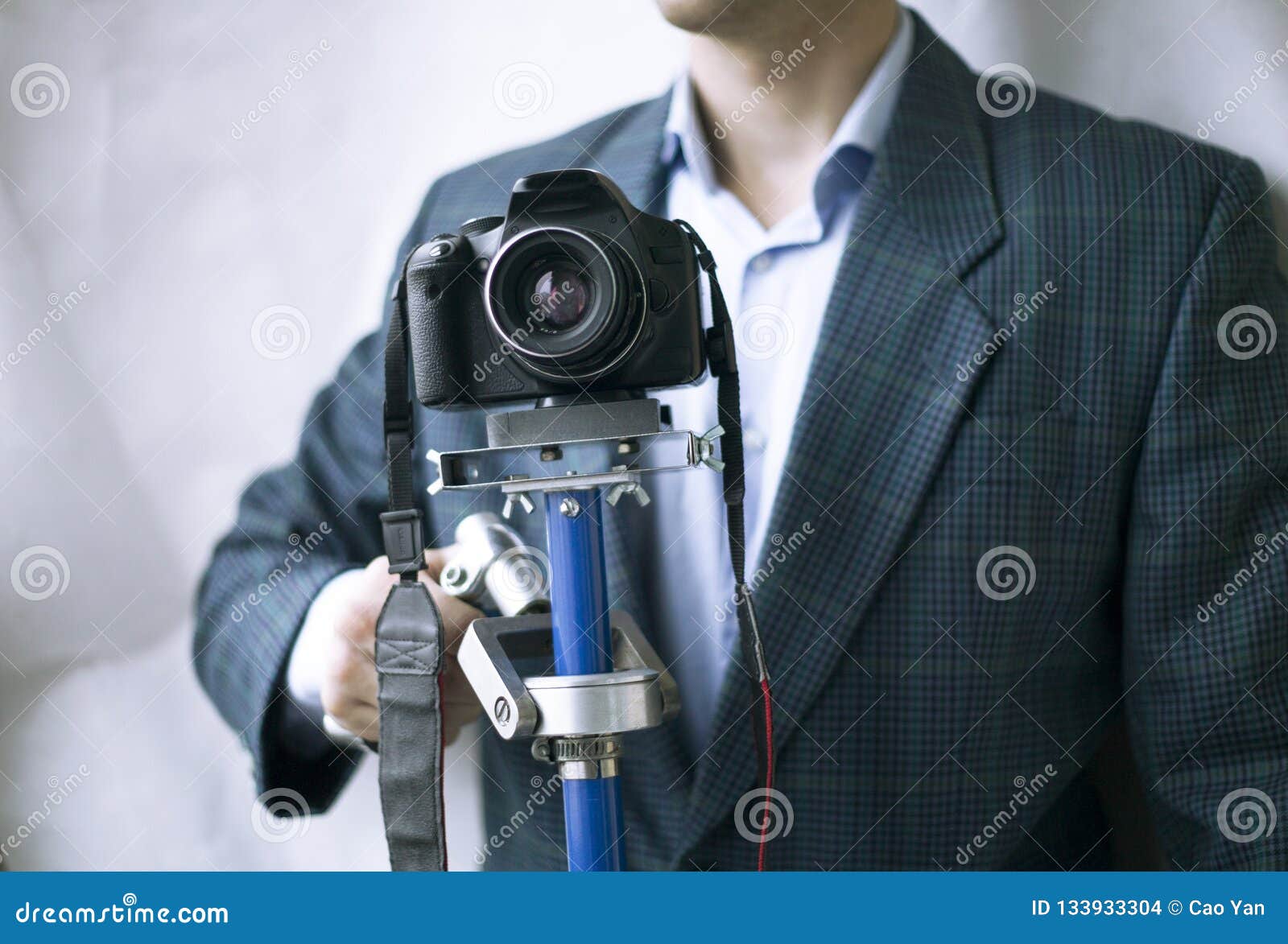Professional Videographer Keeps Steadicam with Camera on White ...