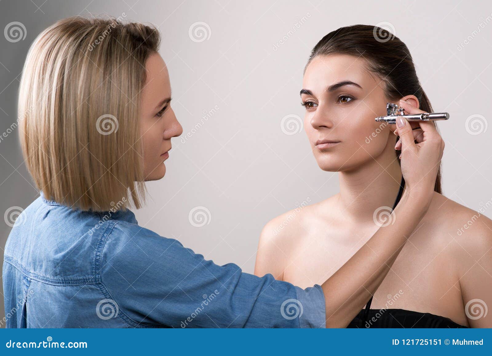 Professional Visagist Doing Makeup And Using Airbrush Girl Doing