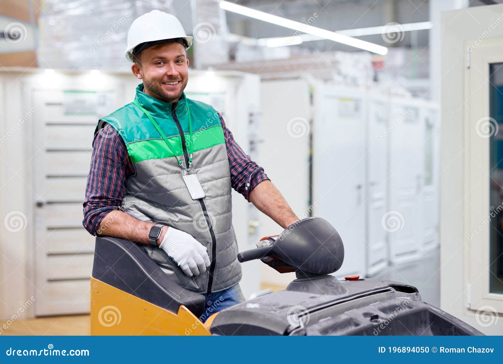 Professional Warehouse Worker Sit Inside of Machine, Doing Logistics ...
