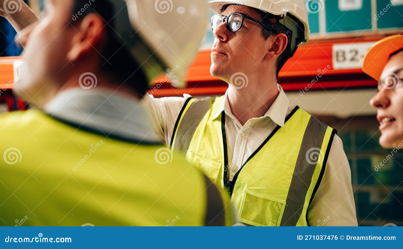 Professional Warehouse Workers with Safety Vest Talking and Discussing ...