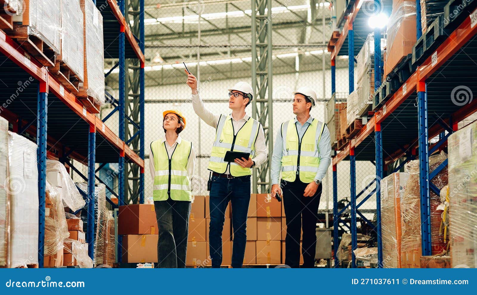 Professional Warehouse Workers with Safety Vest Talking and Discussing ...