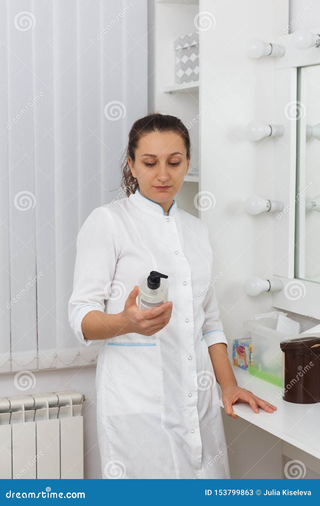 Professional Wax Master. she is Wearing a White Robe and Smiling Stock ...