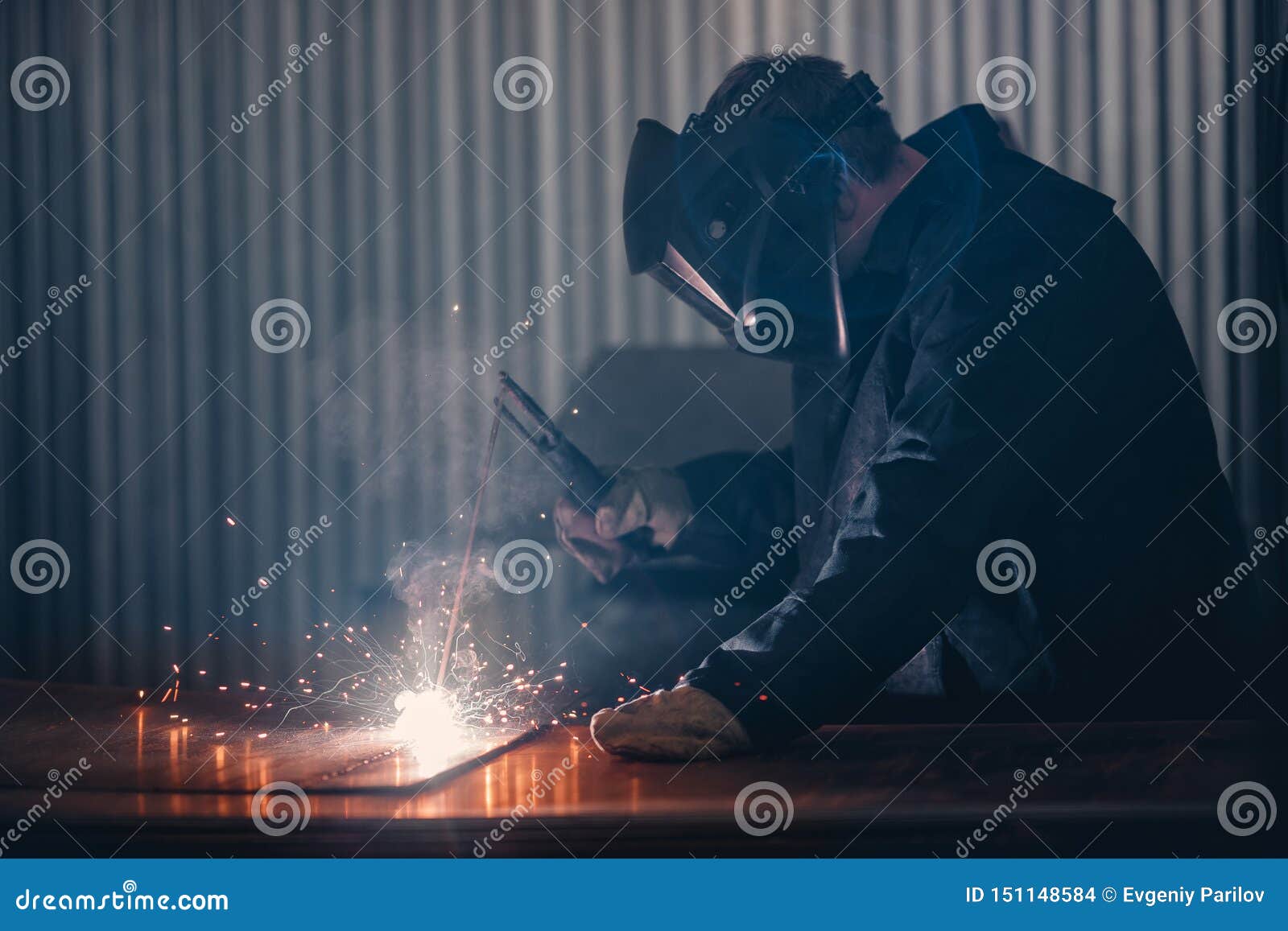 Professional Welder Performs Welding Work on Metal in Protective Mask ...