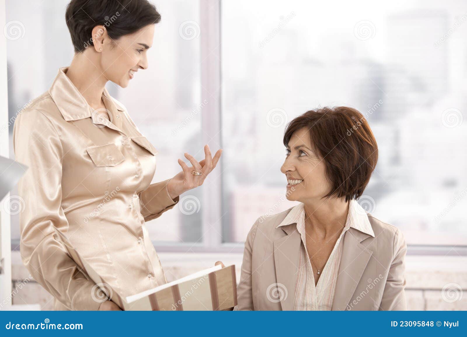 Professional Women in Discussion in Office Stock Photo - Image of busy ...