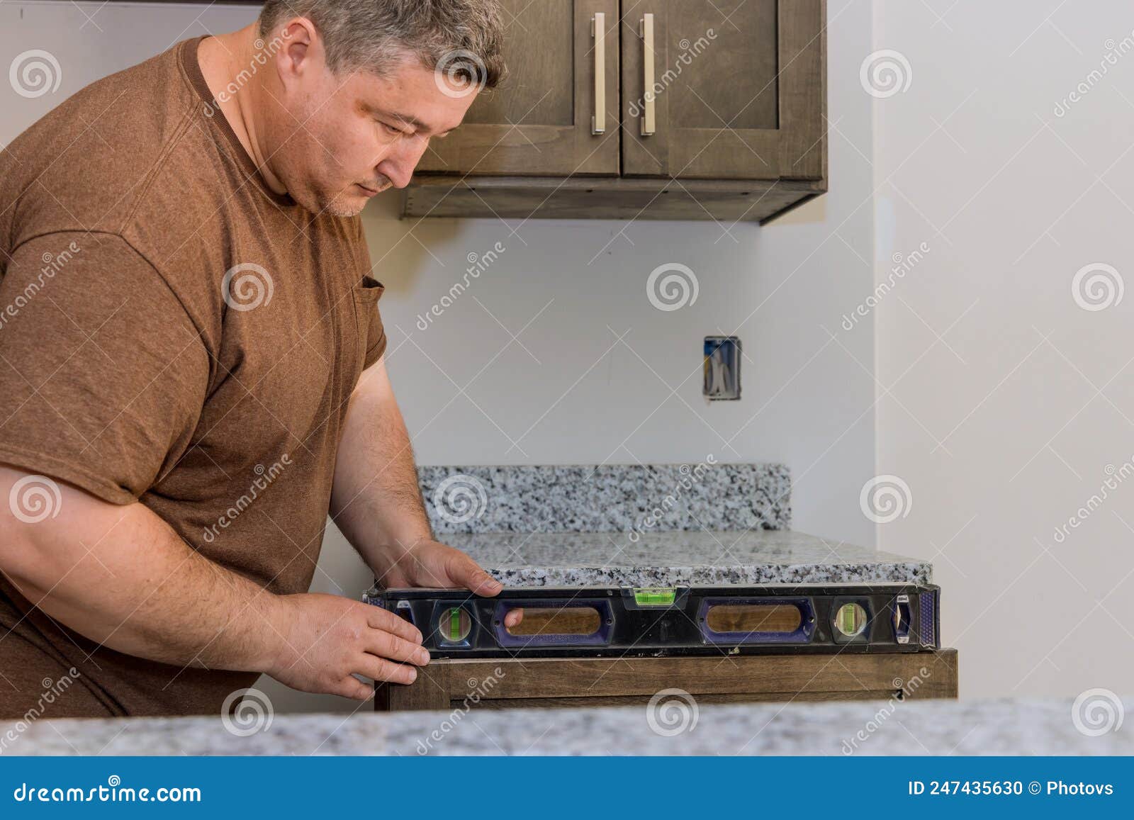 Professional Worker Assembling Leveling Countertop for Cabinet Stock ...