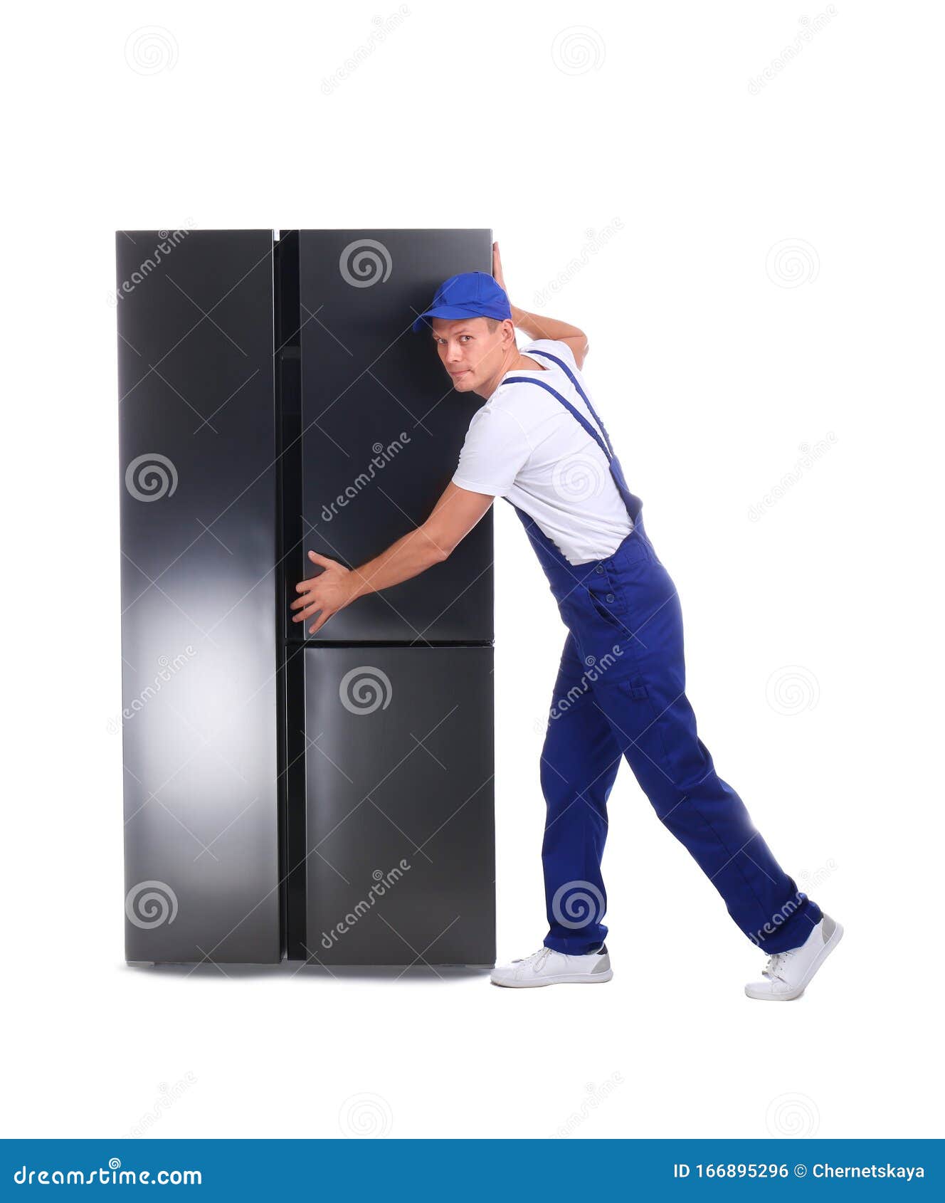 Professional Worker Carrying Refrigerator on Background Stock Photo ...