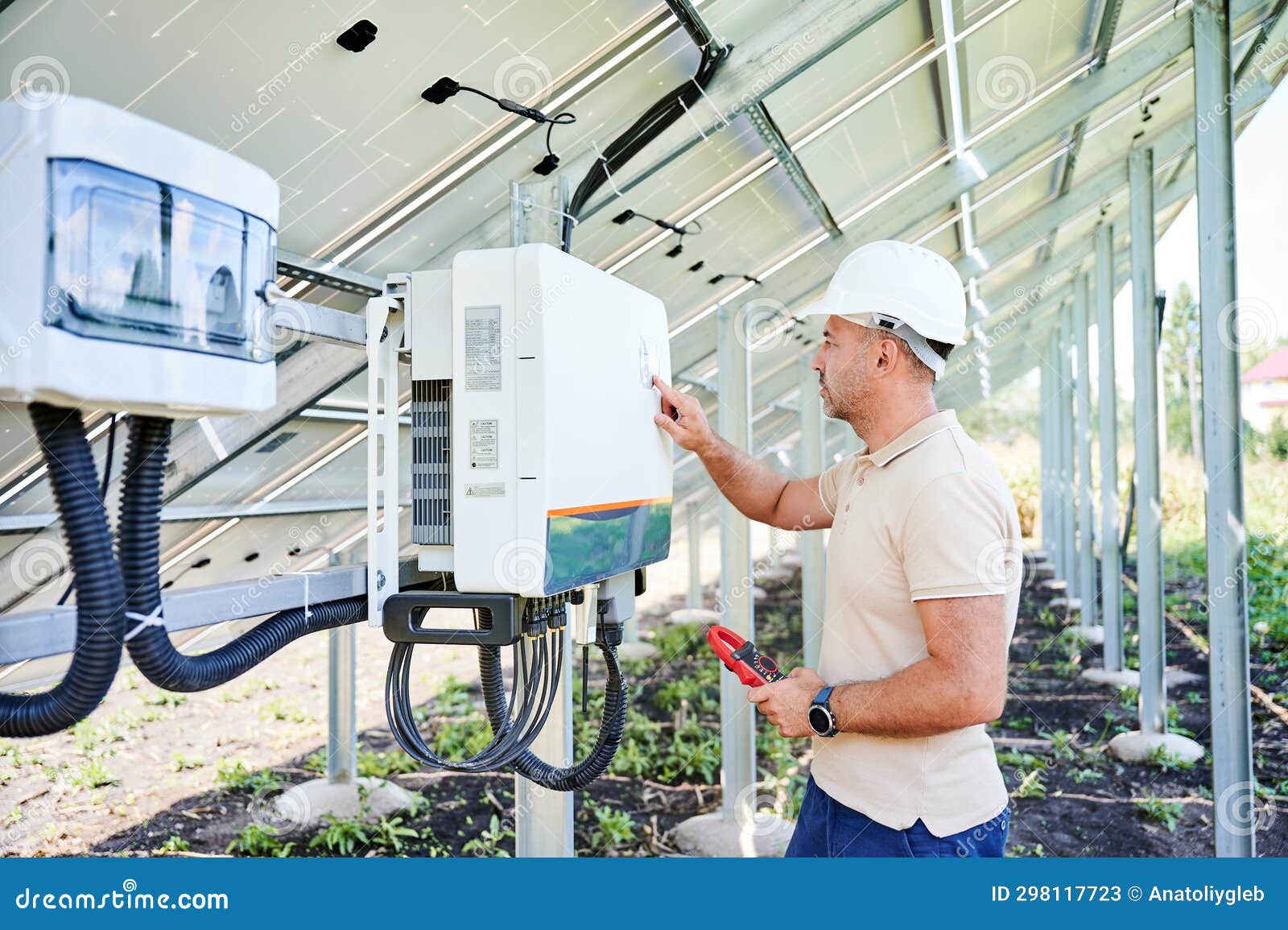 Professional Worker Checking Voltage on Solar Inverter. Stock Image ...