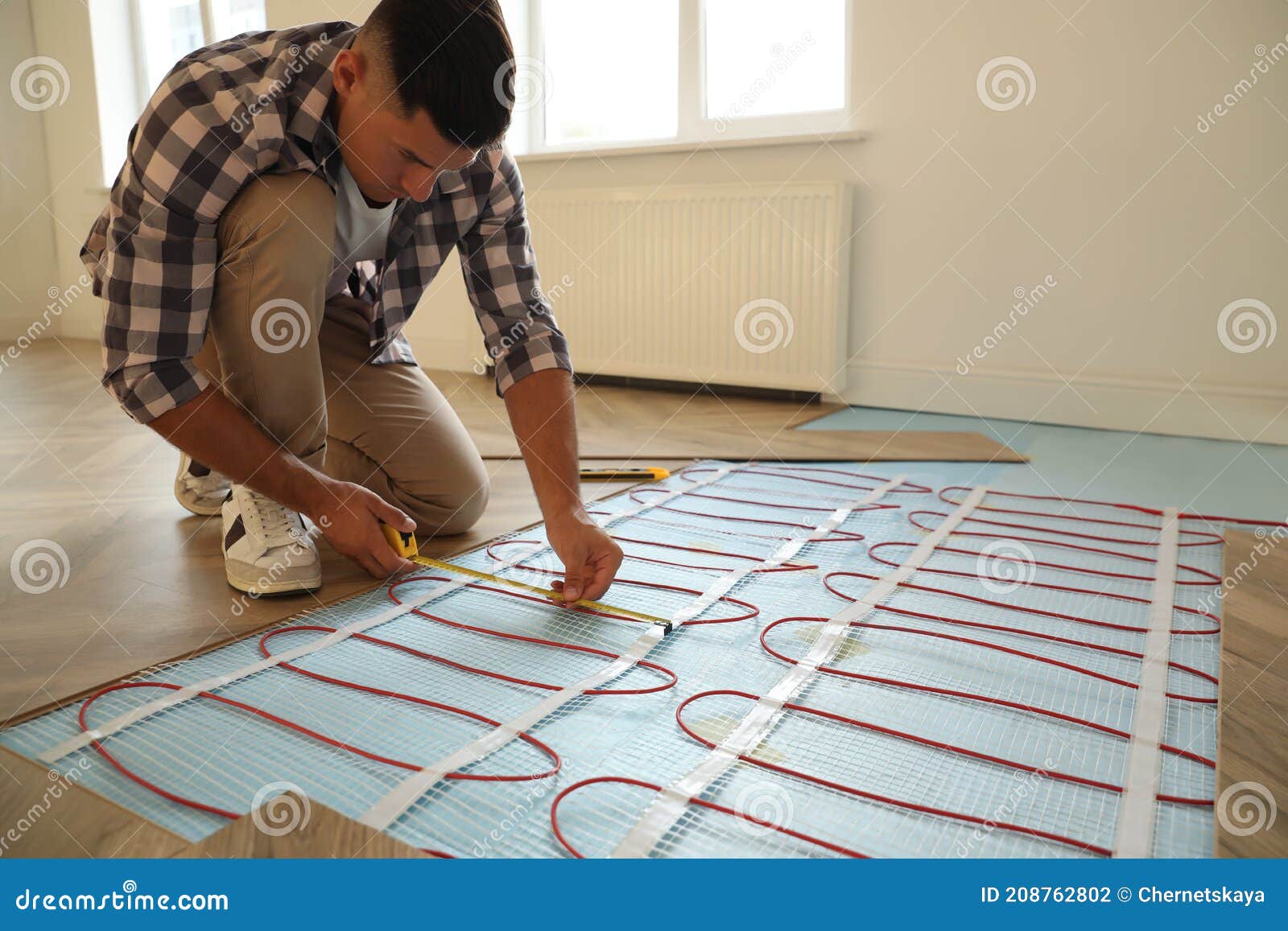 Professional Worker Installing Electric Underfloor Heating System ...
