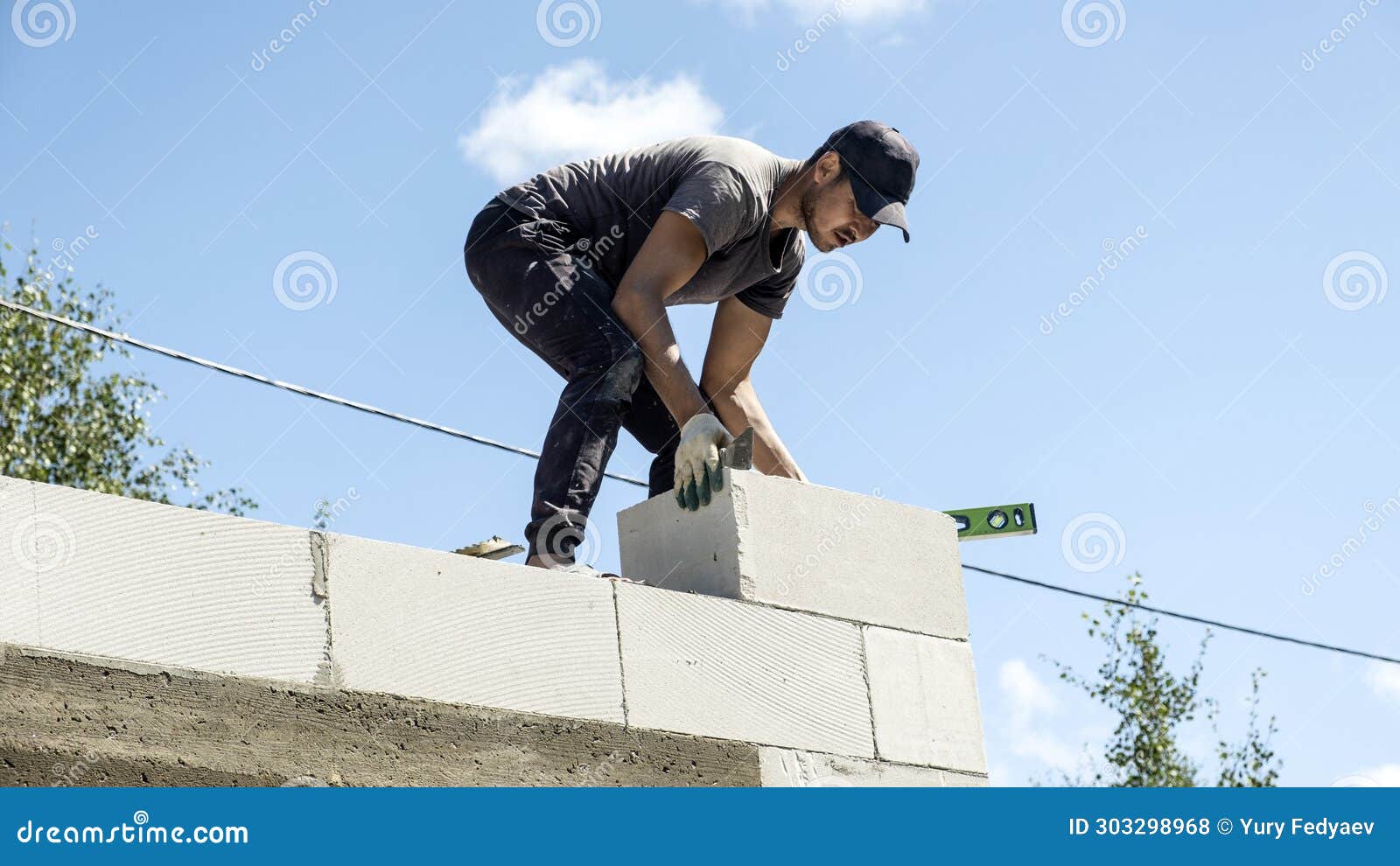 A Professional Worker Lays Concrete Blocks Stock Photo - Image of wall ...