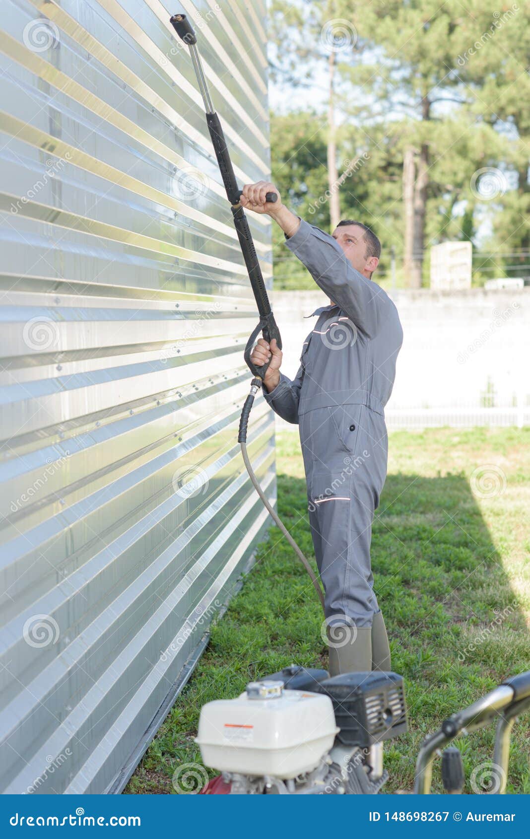 Professional Worker Powerwashing Outside Building Powered by Generator ...