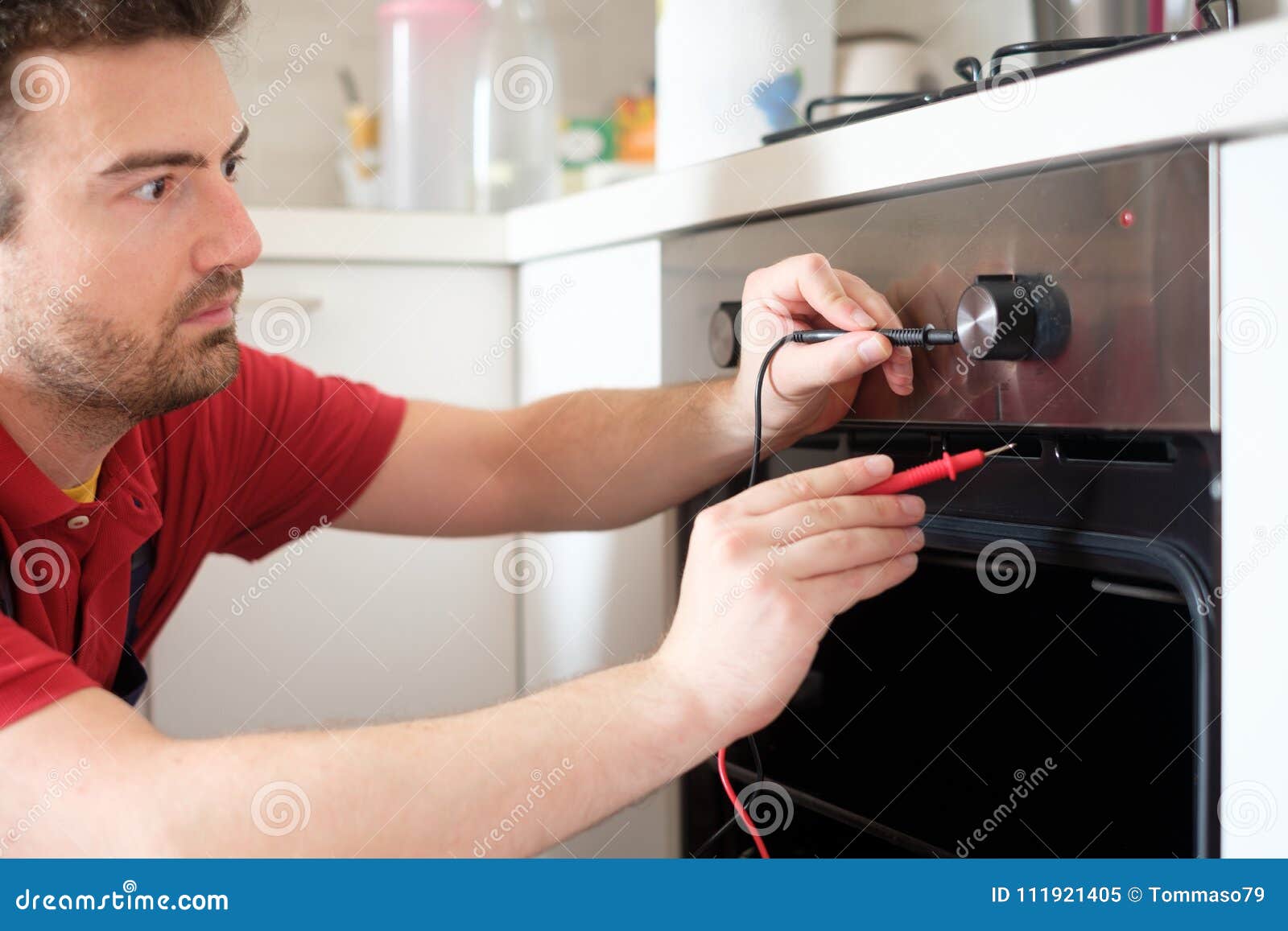 Worker Repairing the Oven in the Kitchen Stock Image - Image of people ...