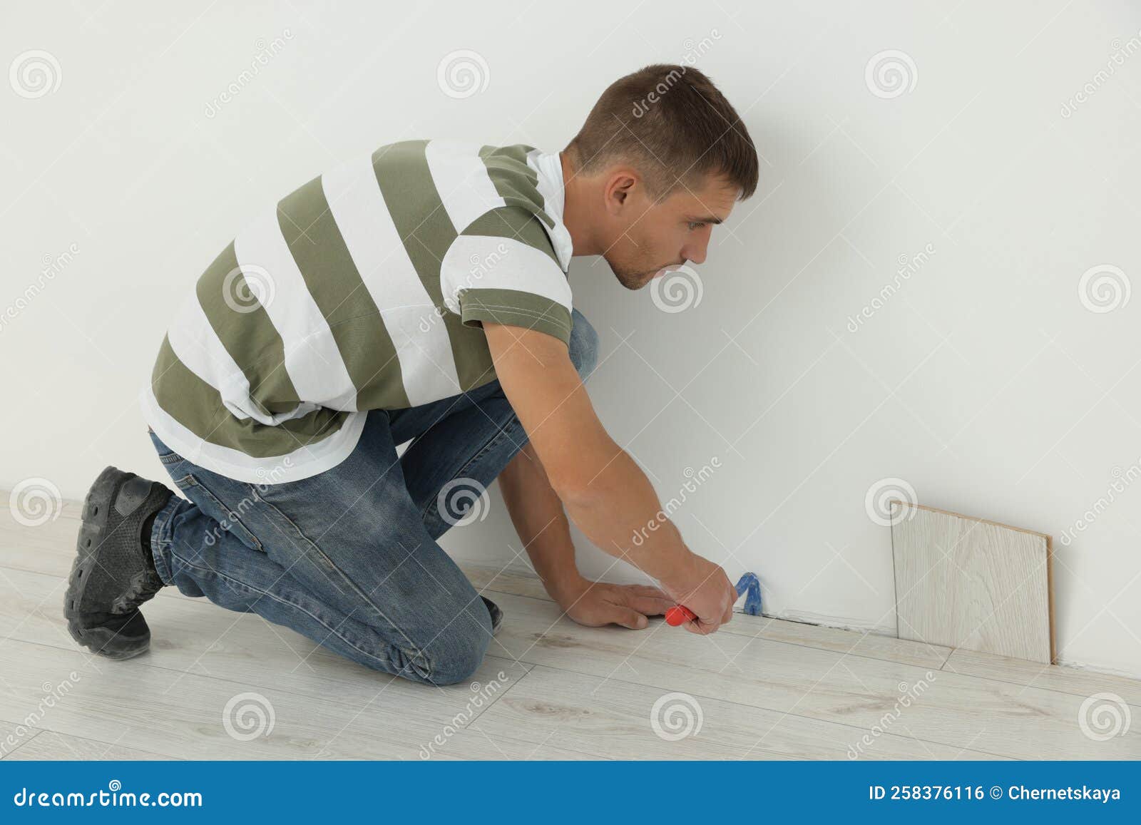 Professional Worker Using Nail Puller during Installation of New ...