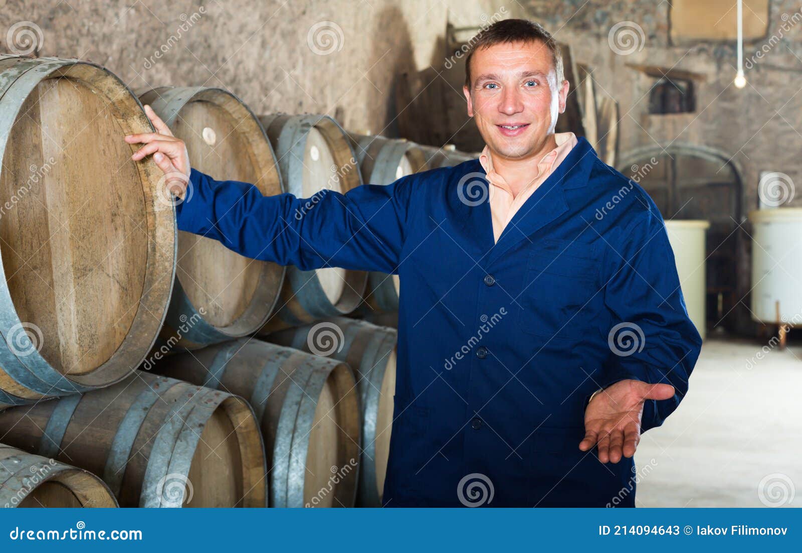 Professional Worker Posing with Wine Barrels Stock Image - Image of ...