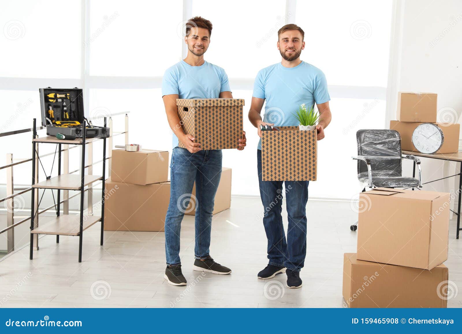 Professional Workers with Cardboard Boxes. Moving Service Stock Photo ...