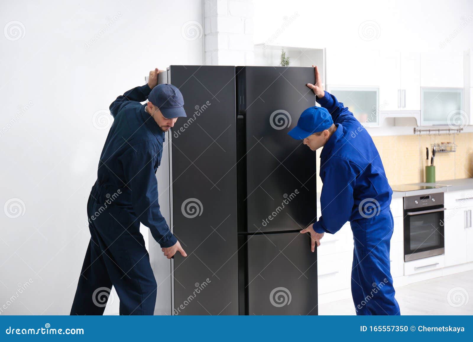 Professional Workers Carrying Modern Refrigerator Stock Photo - Image ...