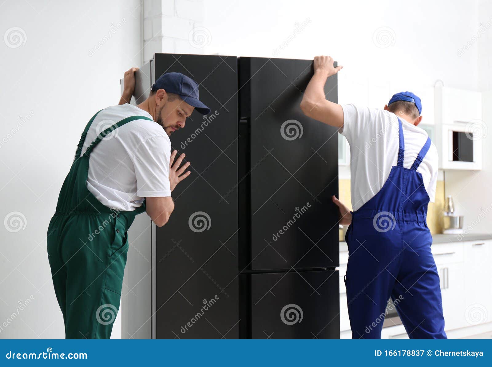Professional Workers Carrying Modern Refrigerator Stock Image - Image ...