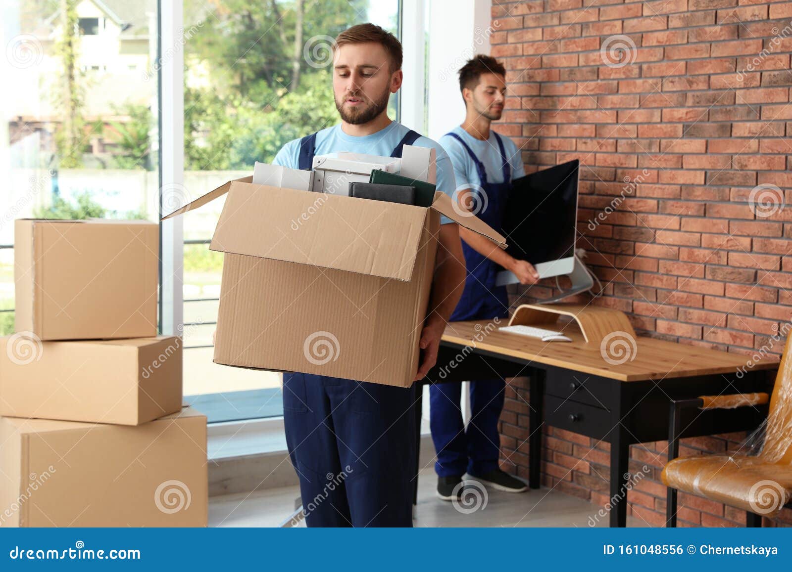 Professional Workers Carrying Stuff. Moving Service Stock Photo - Image ...