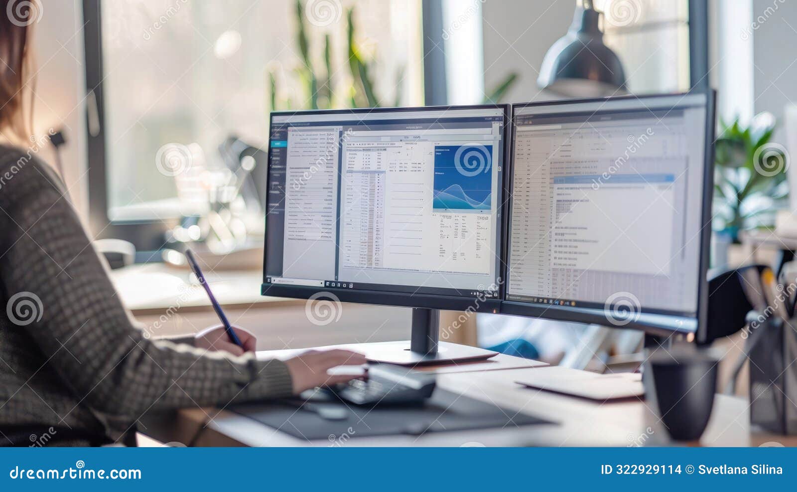 Professional Workspace with Two Monitors Displaying Questionnaire ...