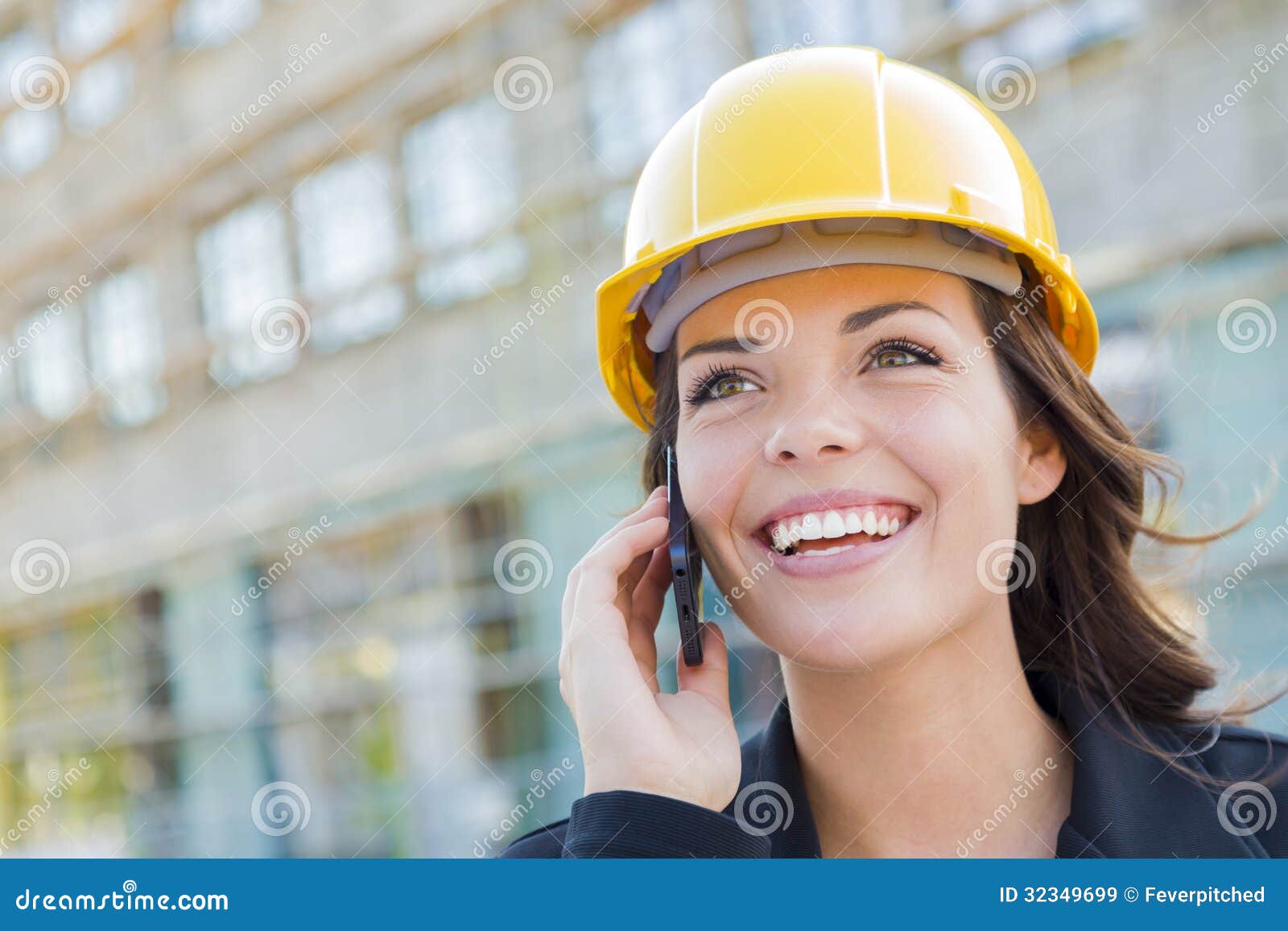 Professional Young Female Contractor Wearing Hard Hat on Site Using ...