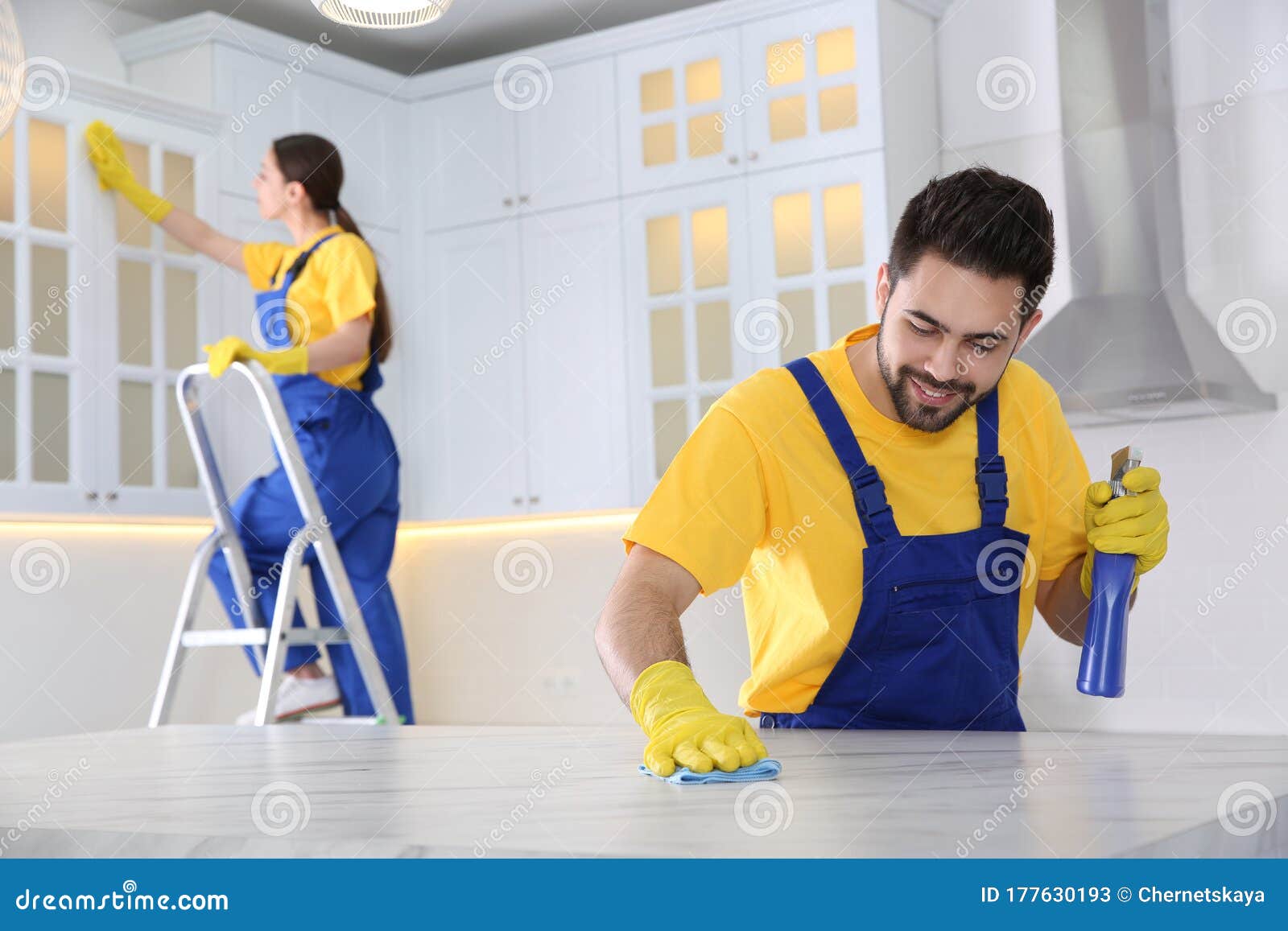 Professional Janitor Cleaning Table in Kitchen Stock Image - Image of ...