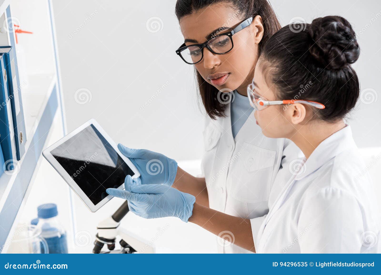 Professional Young Scientists Using Digital Tablet while Making ...