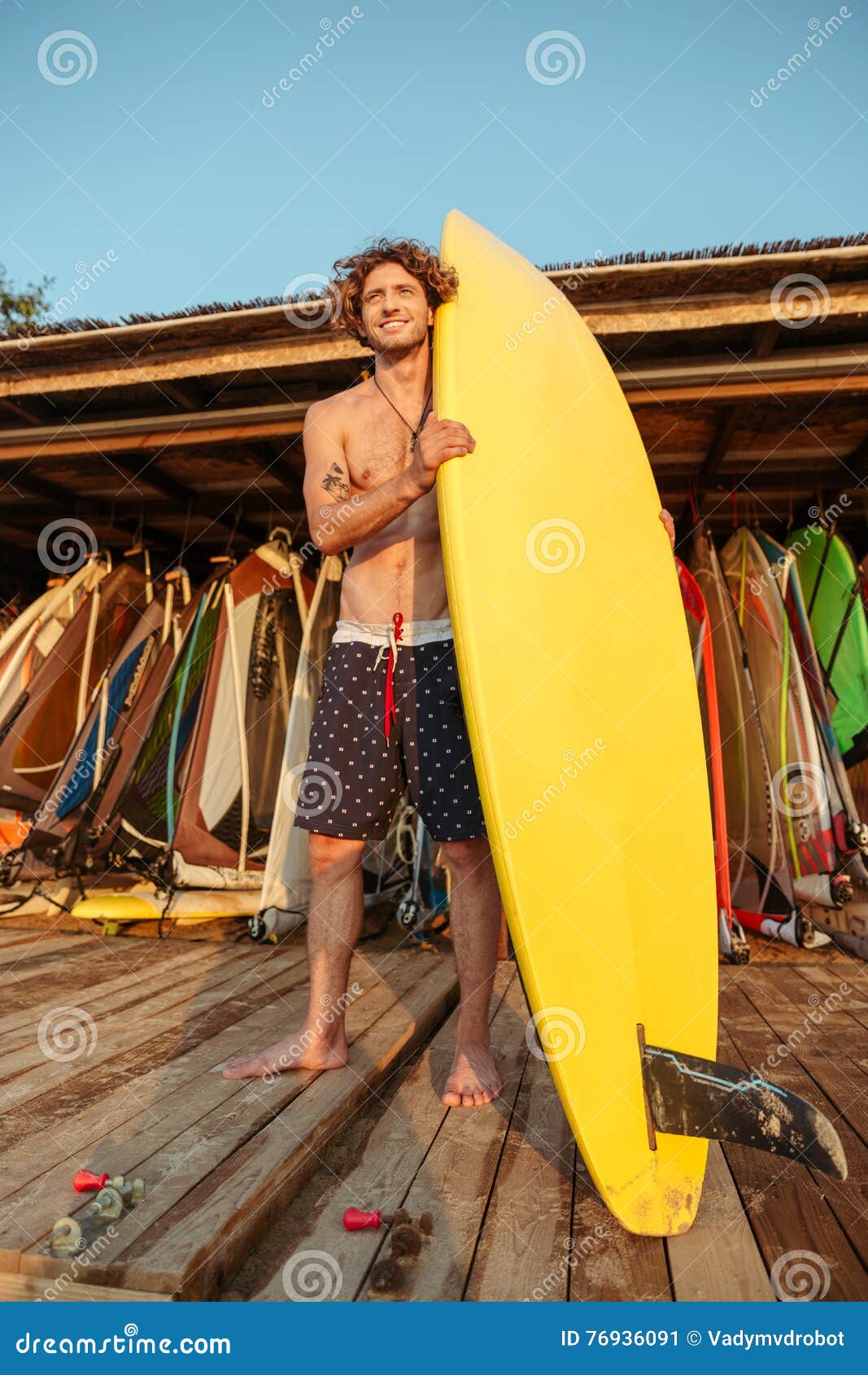 Professional Young Surfer Getting Board Ready for Surf Stock Image ...