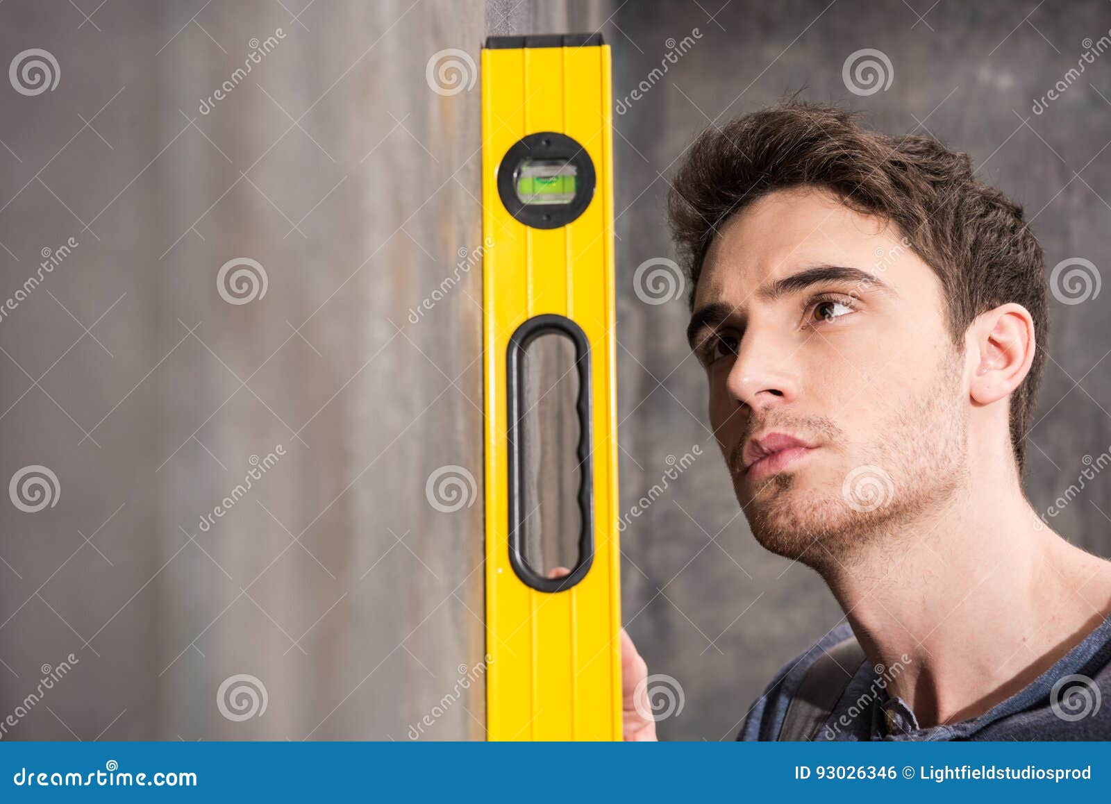 Professional Young Worker Measuring Wall with Level Tool Stock Photo ...