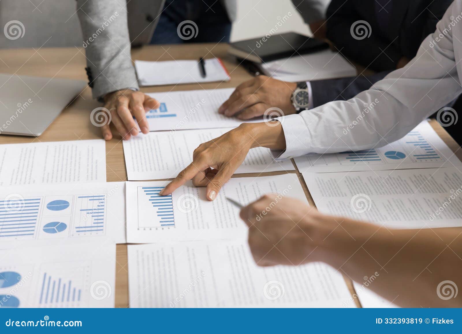 Professionals Gathered Around Table To Examining and Discussing ...
