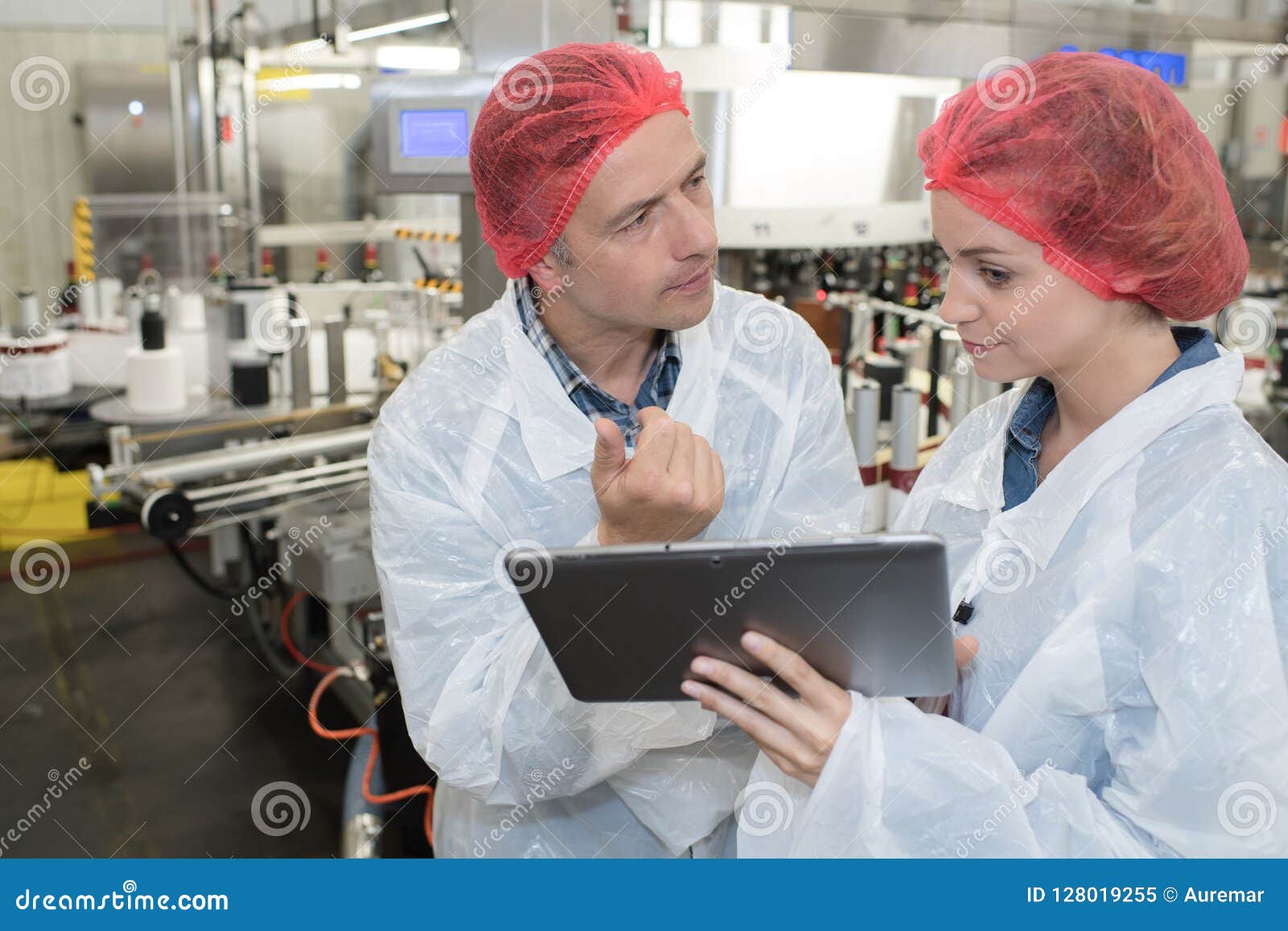 Professionals in Safety Uniform at Work in High Tech Environment Stock ...
