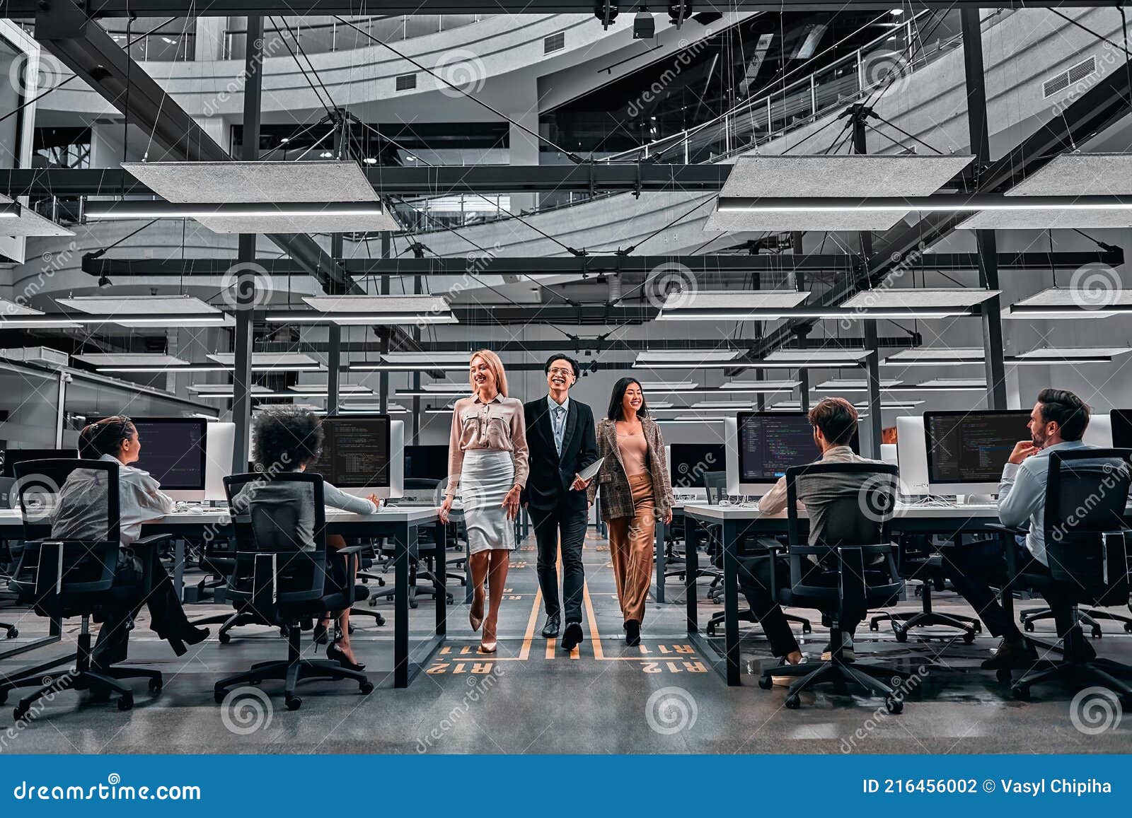 Professionals at Work. Three Business People Walk Around a Spacious ...