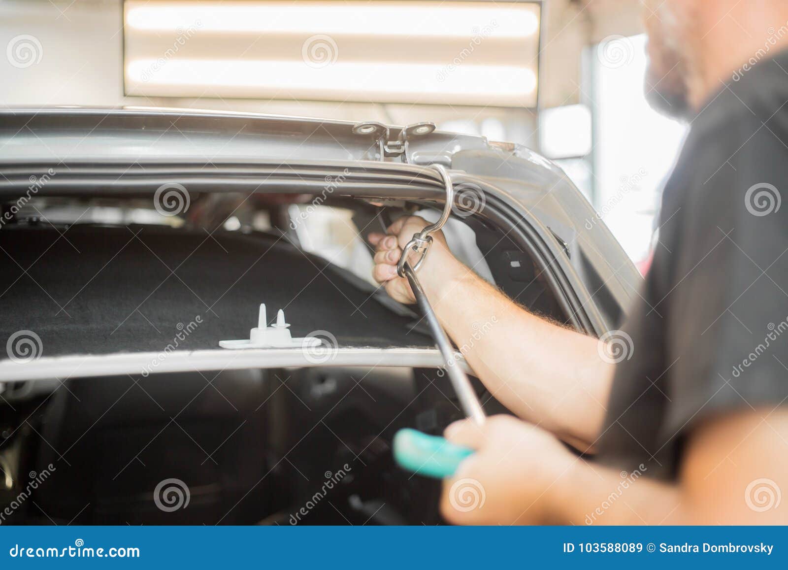 Repairing dents in a car stock image. Image of indoors - 103588089