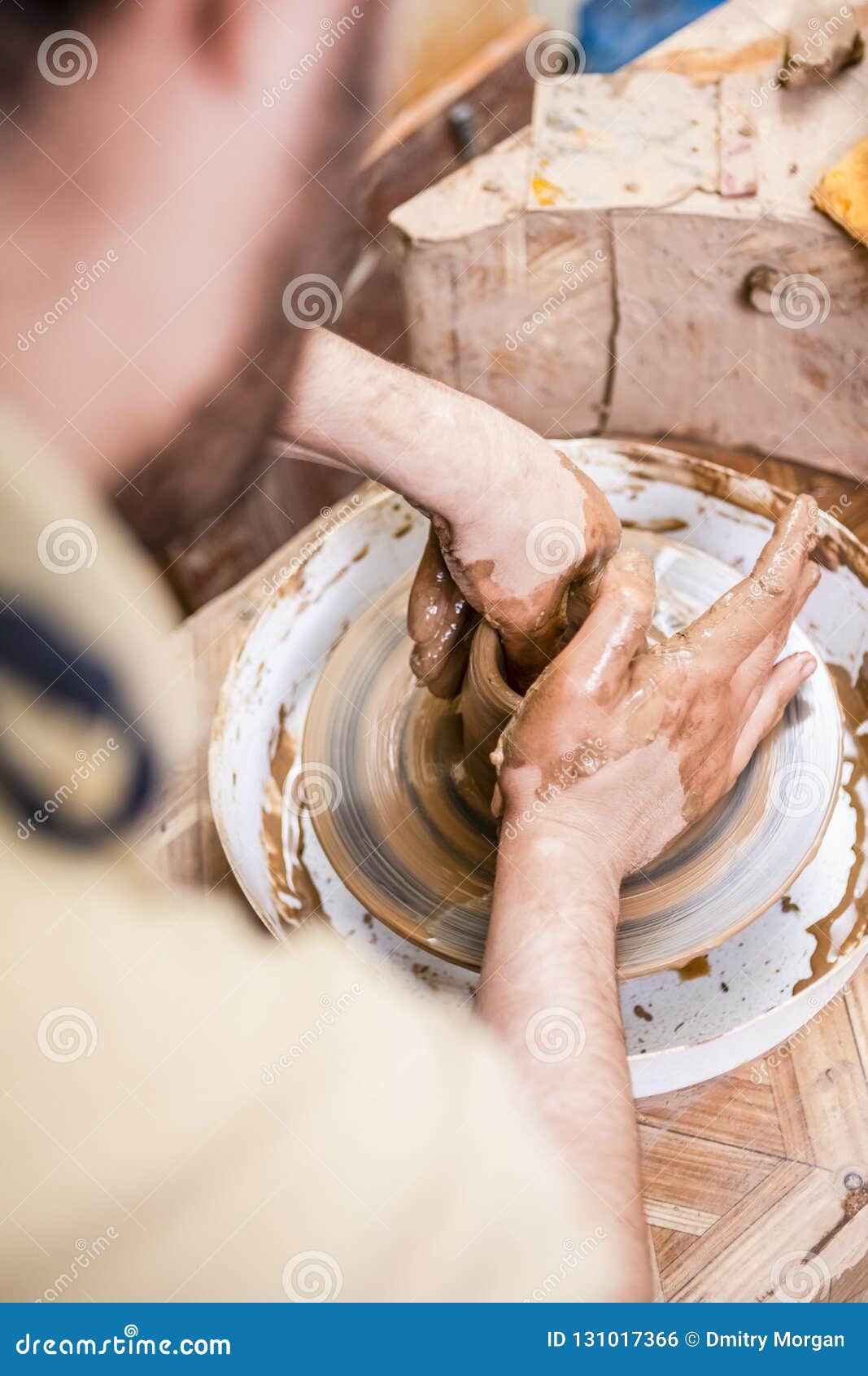 Man Working with Clay on Potter`s Wheel Inside of Workshop Stock Photo ...