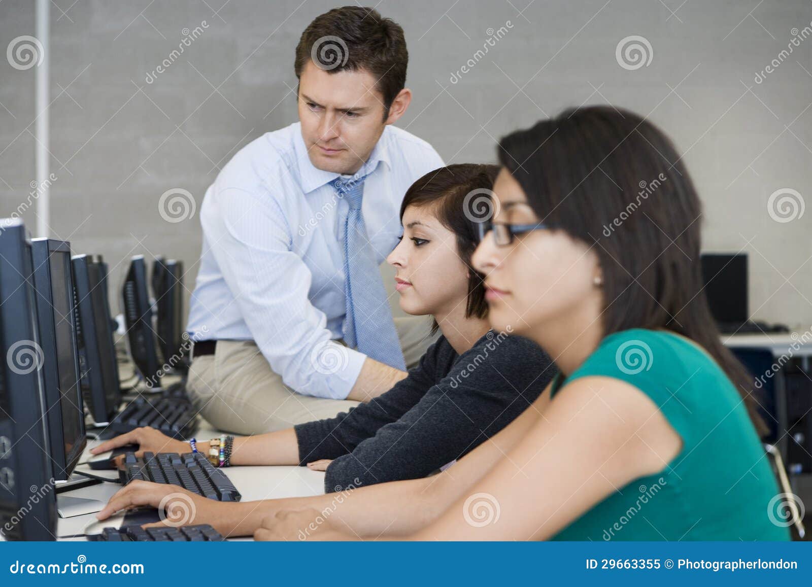 Professor Assisting Computer Students Stock Image - Image of class ...