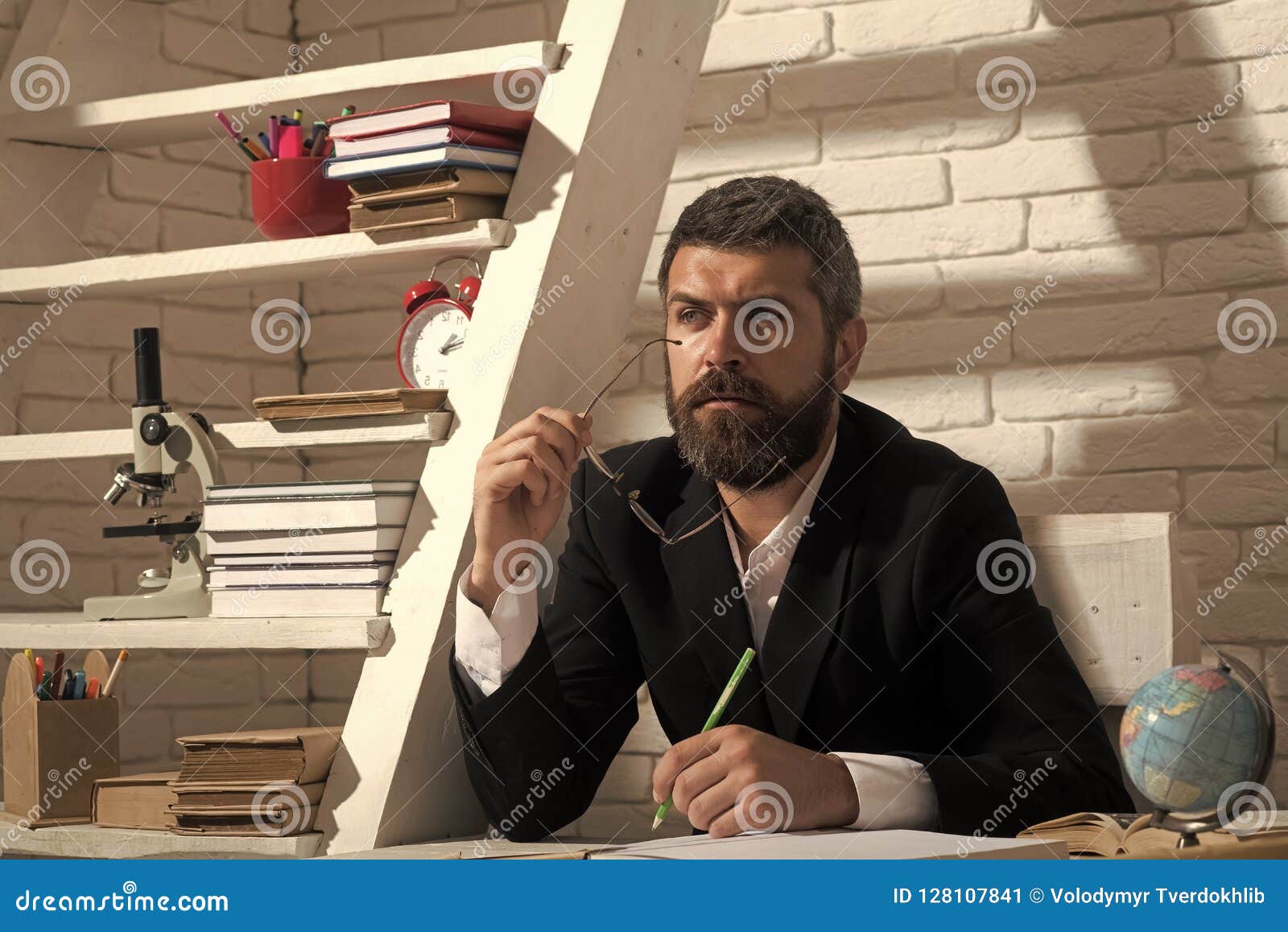 Professor with Concentrated Face Expression Sits at Desk Stock Image ...