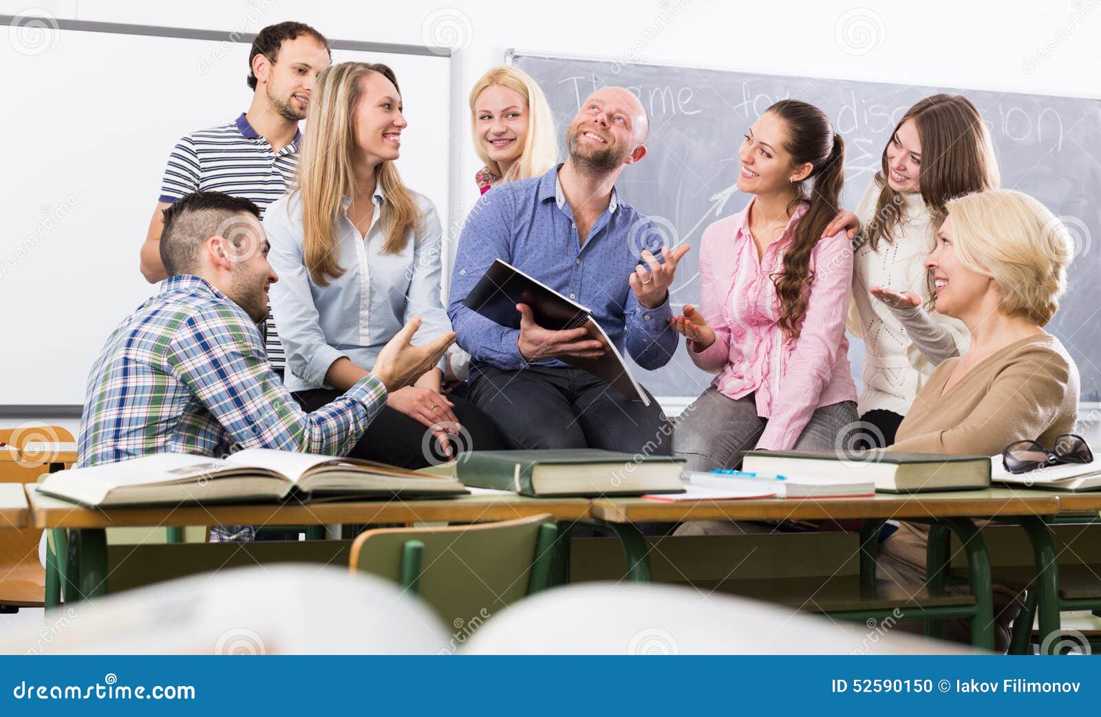 Professor Consulting Different Age Students Stock Photo - Image of ...