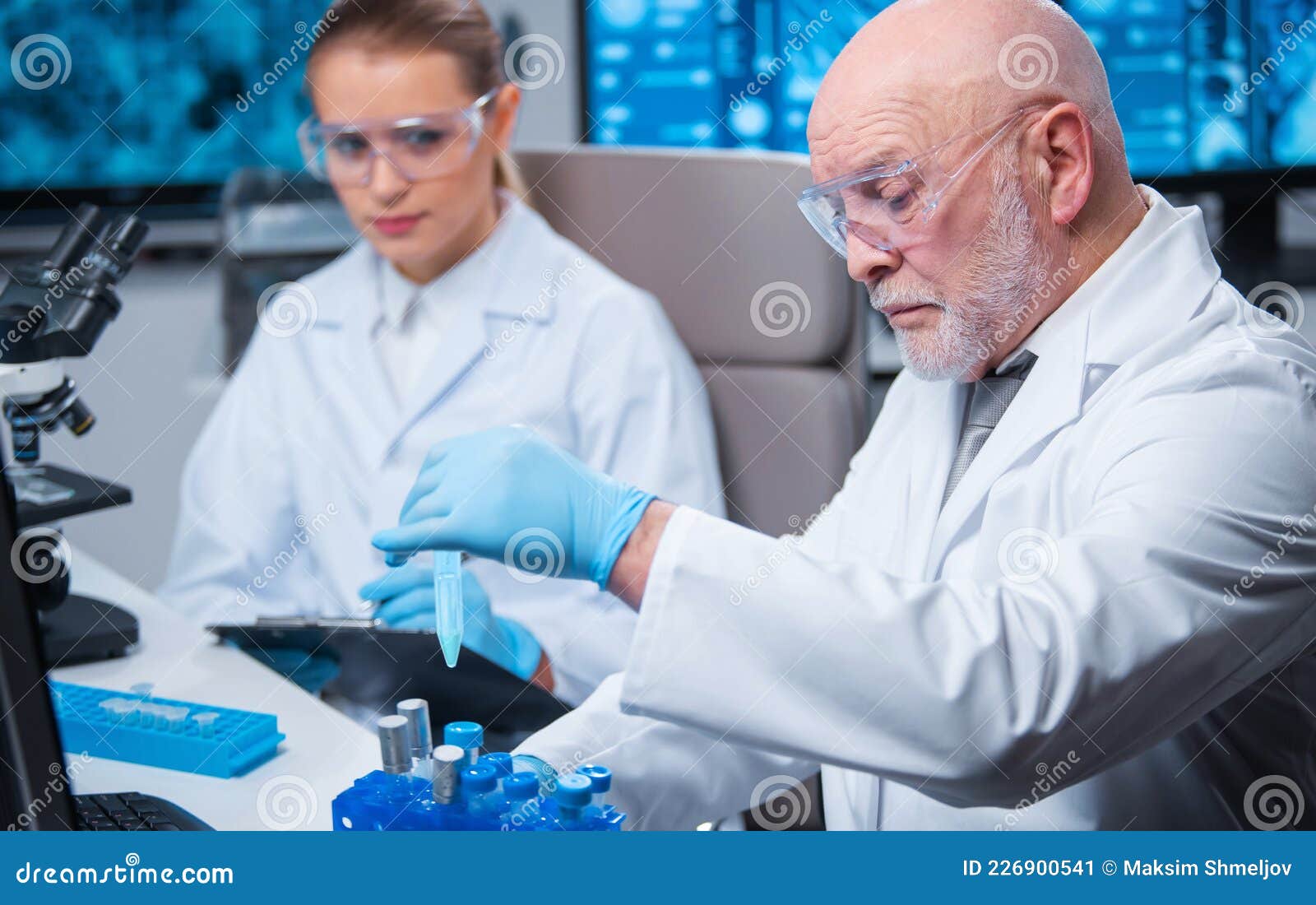 Professor and Doctor Work in a Modern Scientific Laboratory Using ...