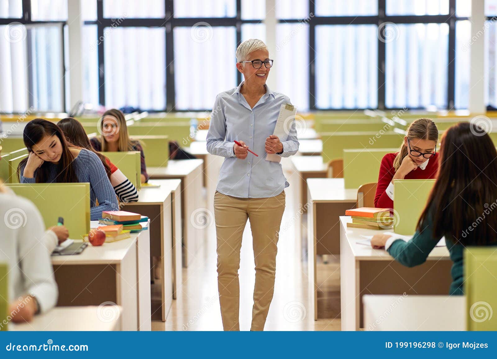 The Professor Giving a Lecture. Smart Young People Study at the College ...