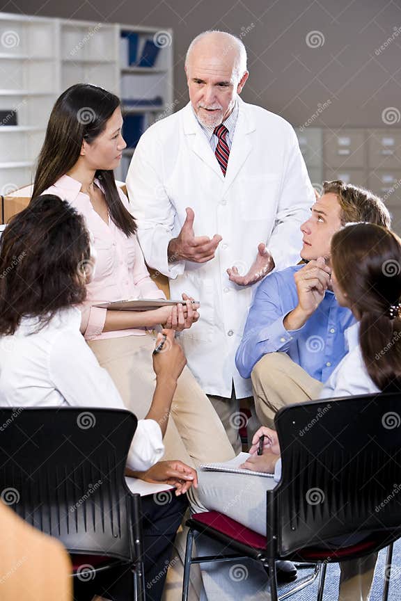 Professor Having Discussion with College Students Stock Photo - Image ...