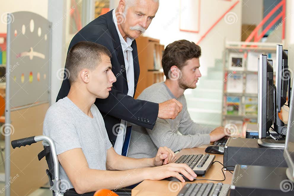Professor Helping Students during Class One Disabled Stock Image ...