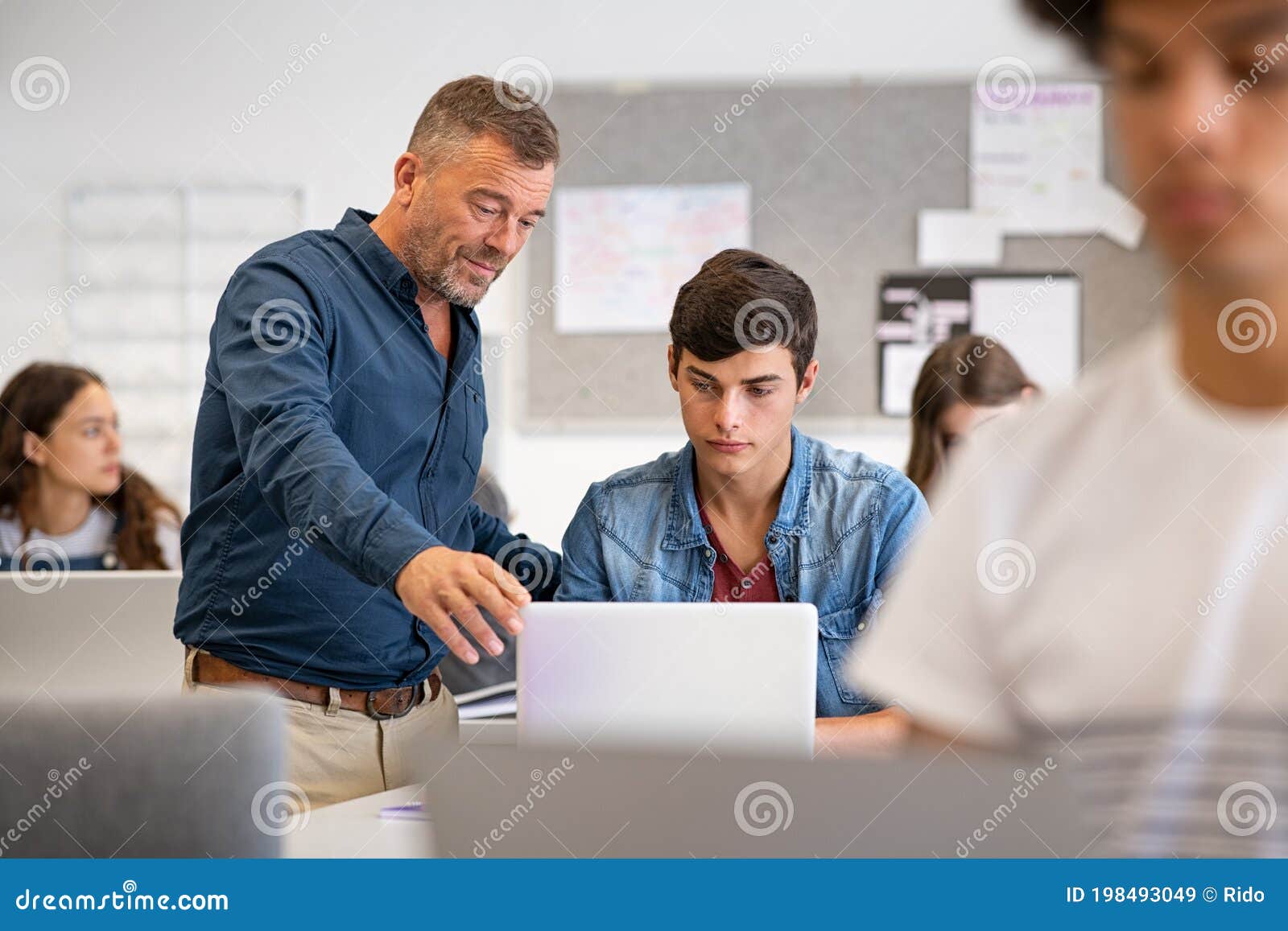 Professor Helping Student during Computer Class Stock Image - Image of ...