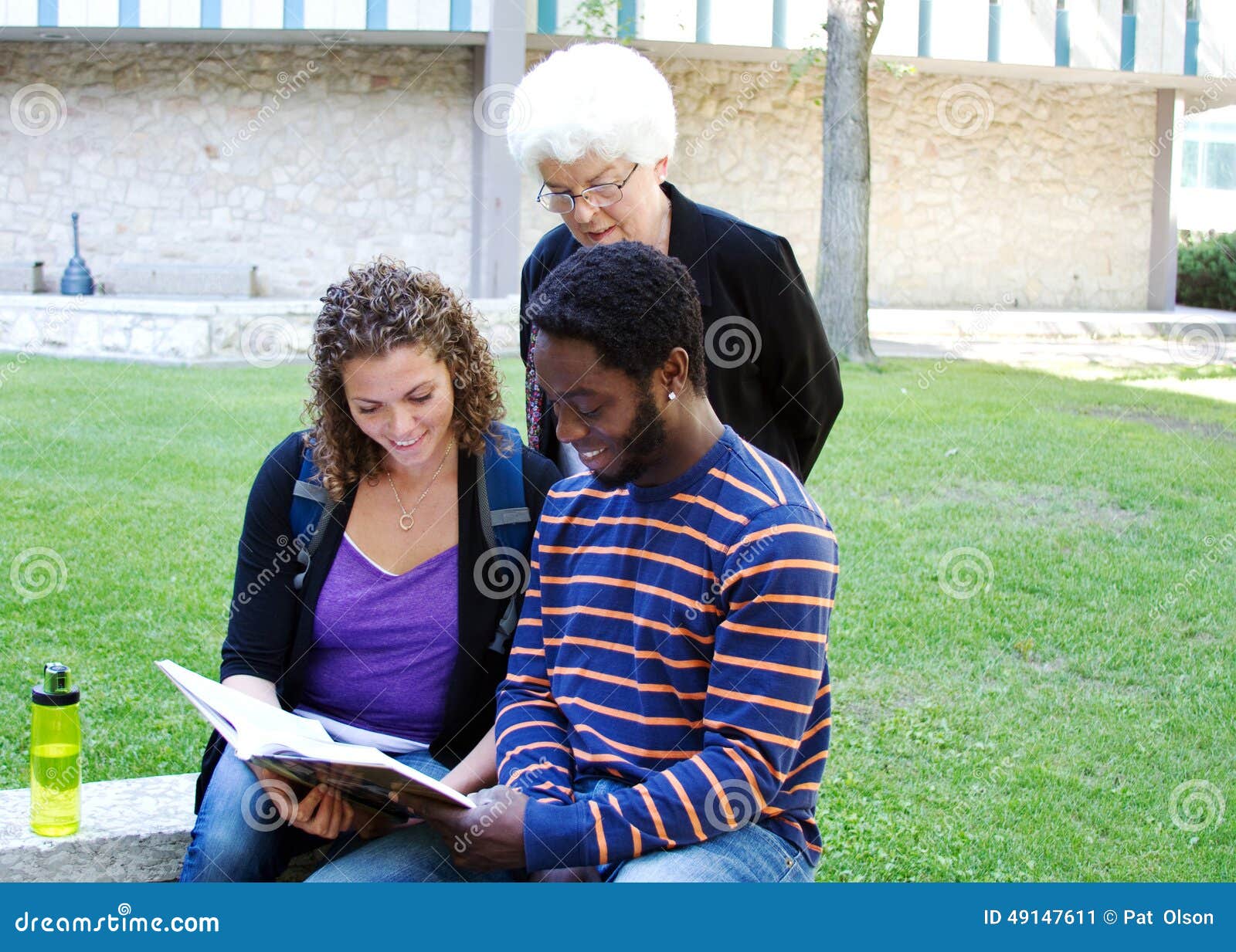 Professor helping students stock image. Image of happy - 49147611