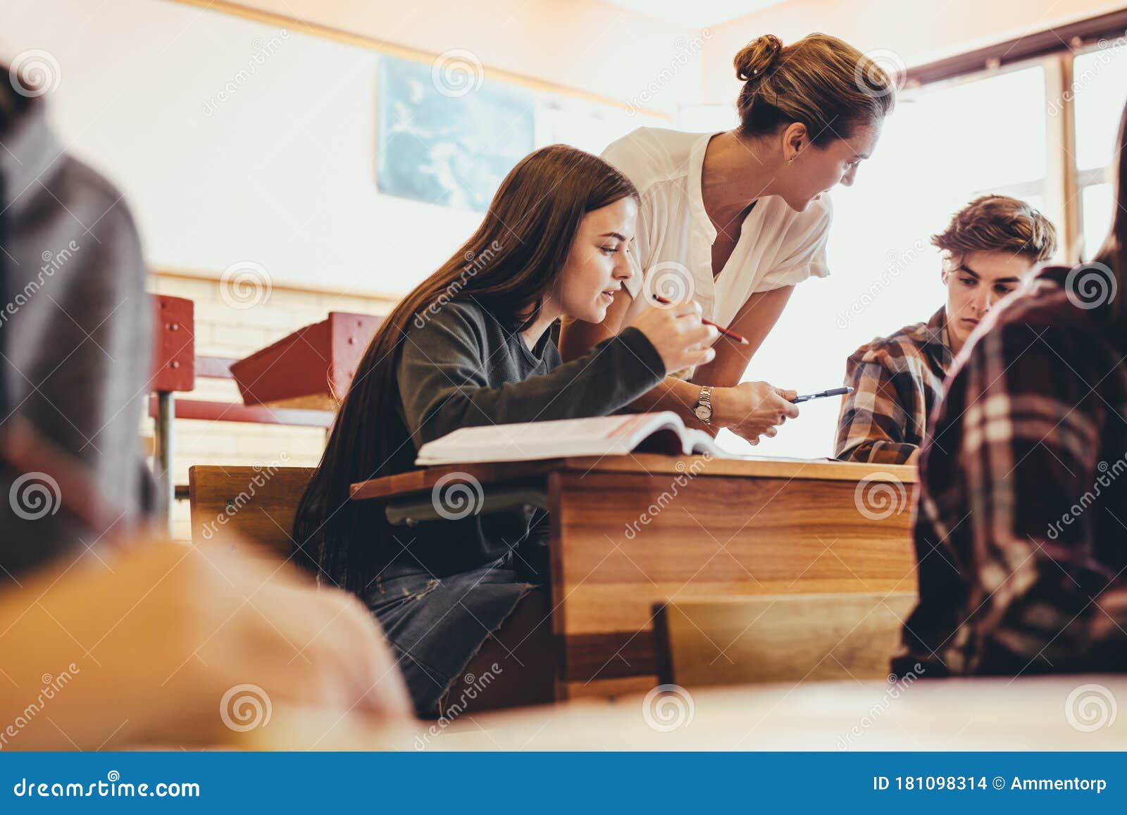 Professor Helping Students during a Class at High School Stock Photo ...