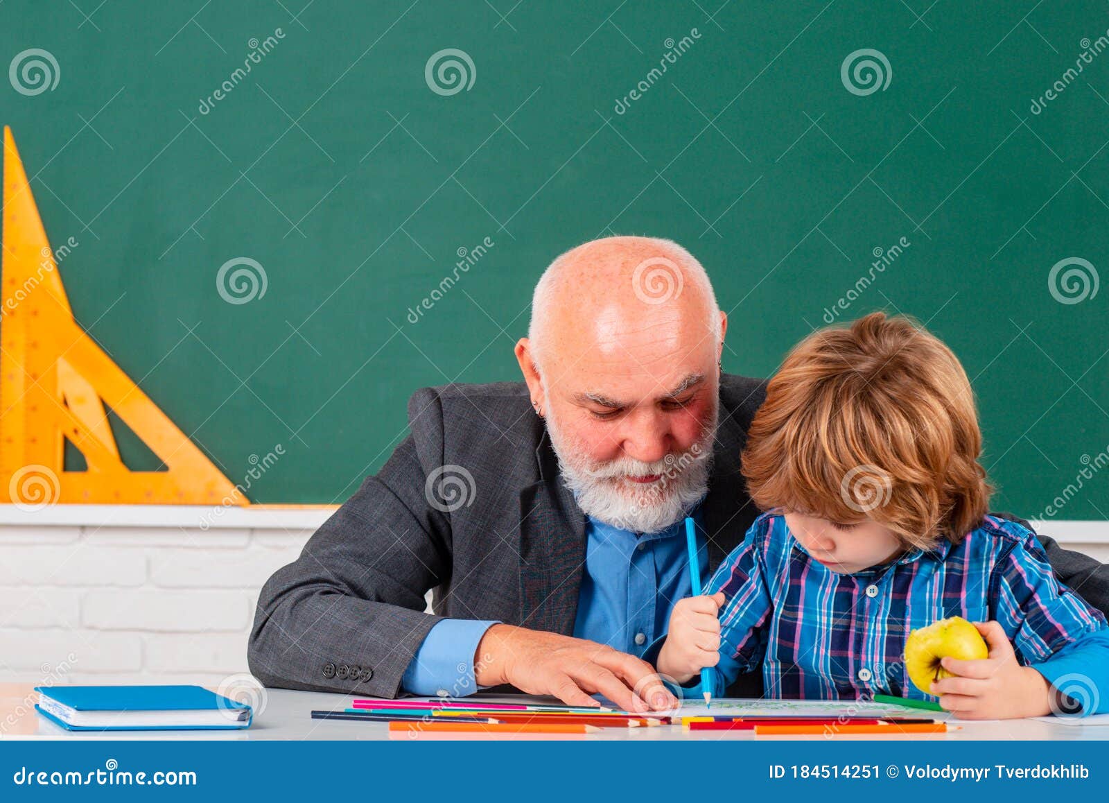 Professor and Pupil in Classroom at the Elementary School. Elementary ...