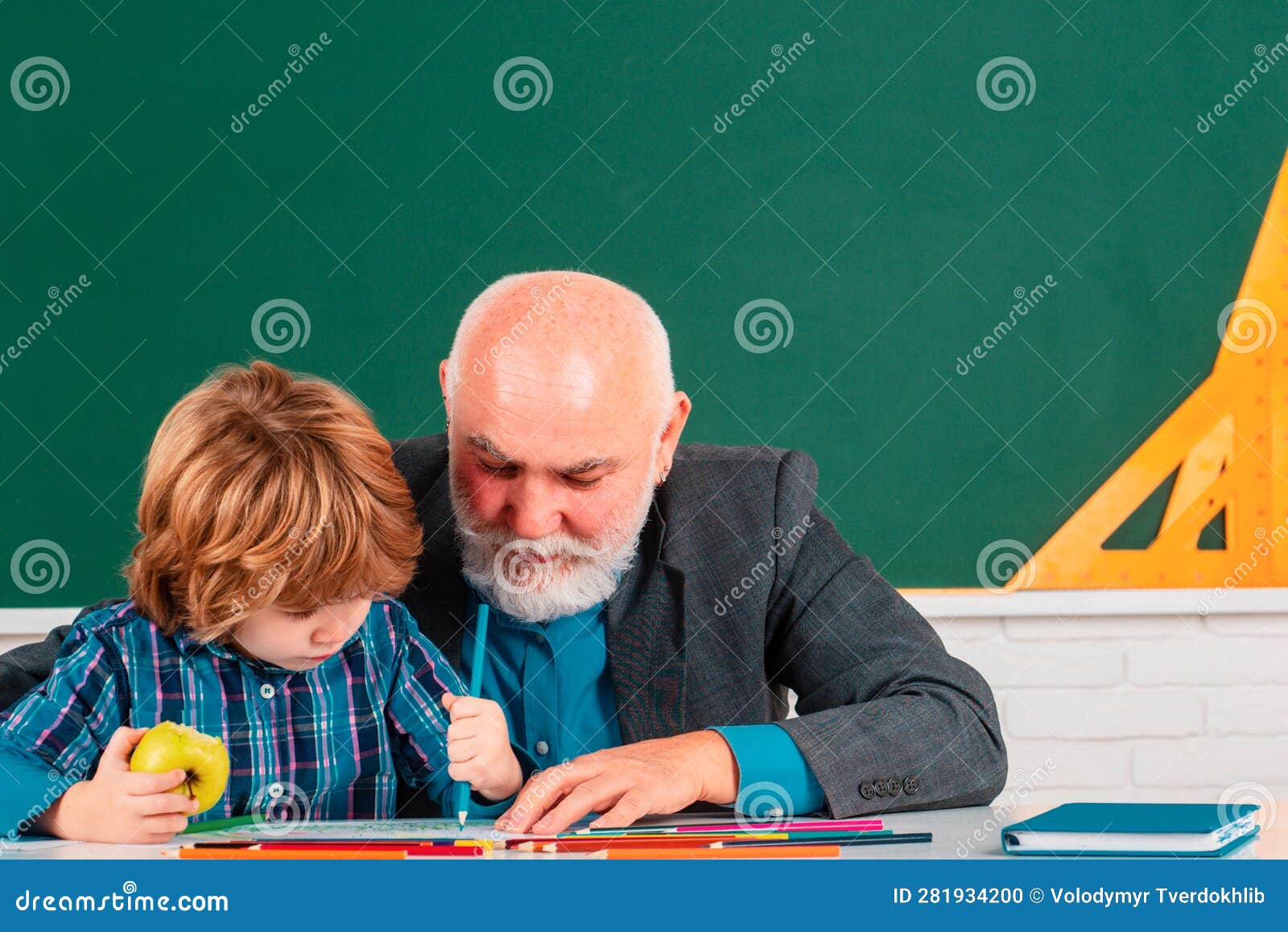 Professor And Pupil In Classroom At The Elementary School. Child At ...